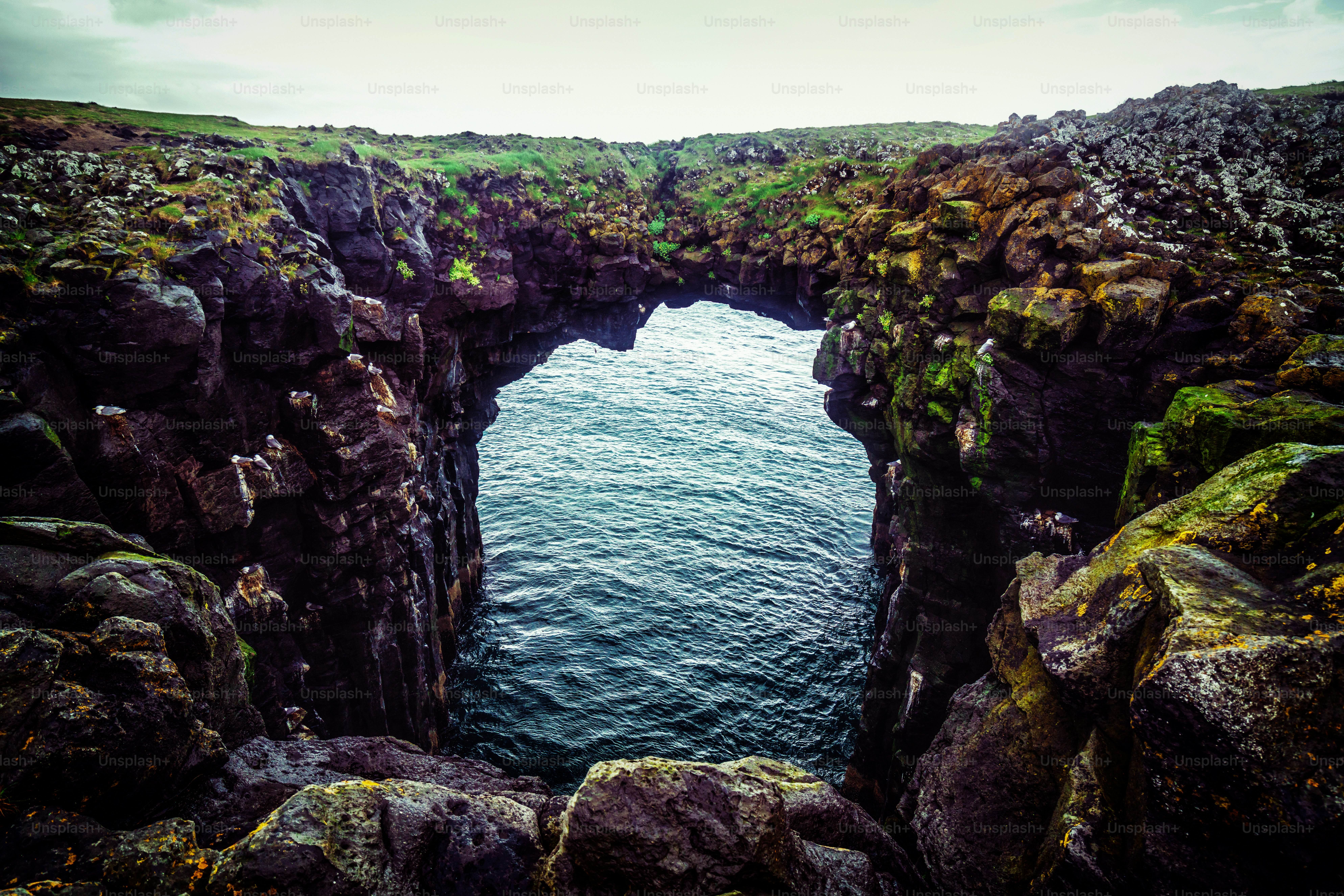 Rock bridge landscape in Arnarstapi, Iceland. Arnarstapi was an ...