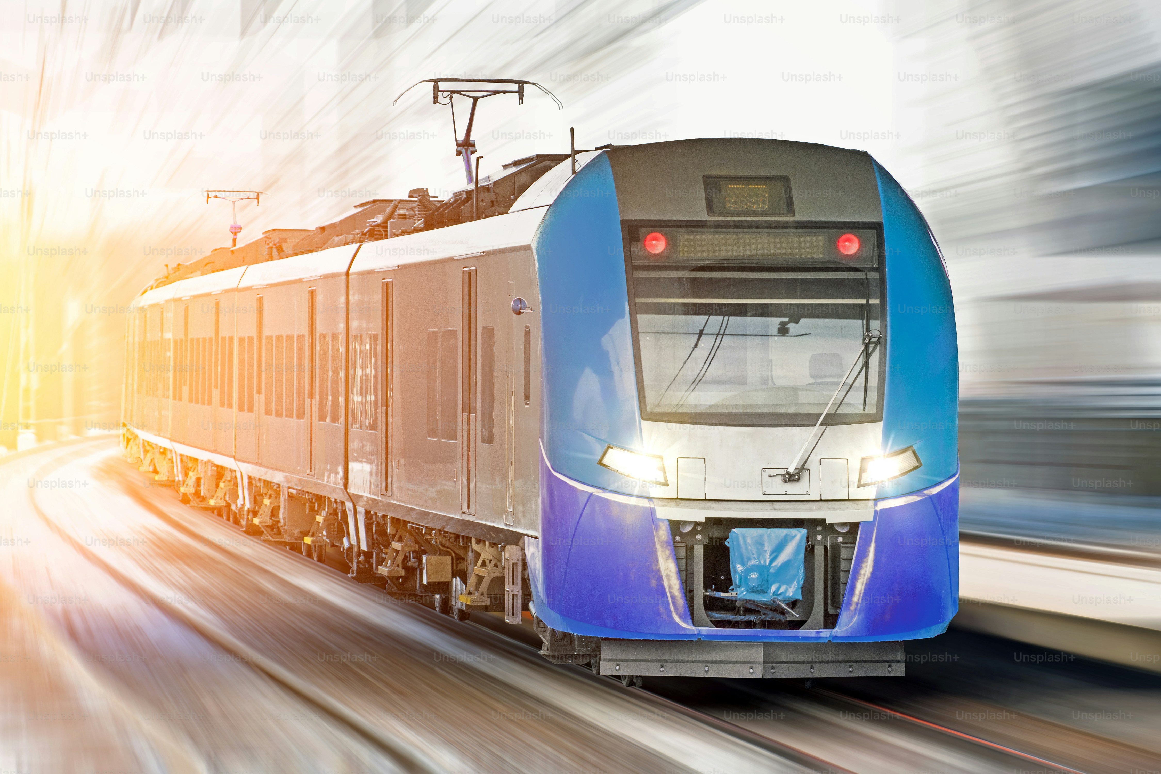 High speed train rides at high speed at the railway station in the city ...