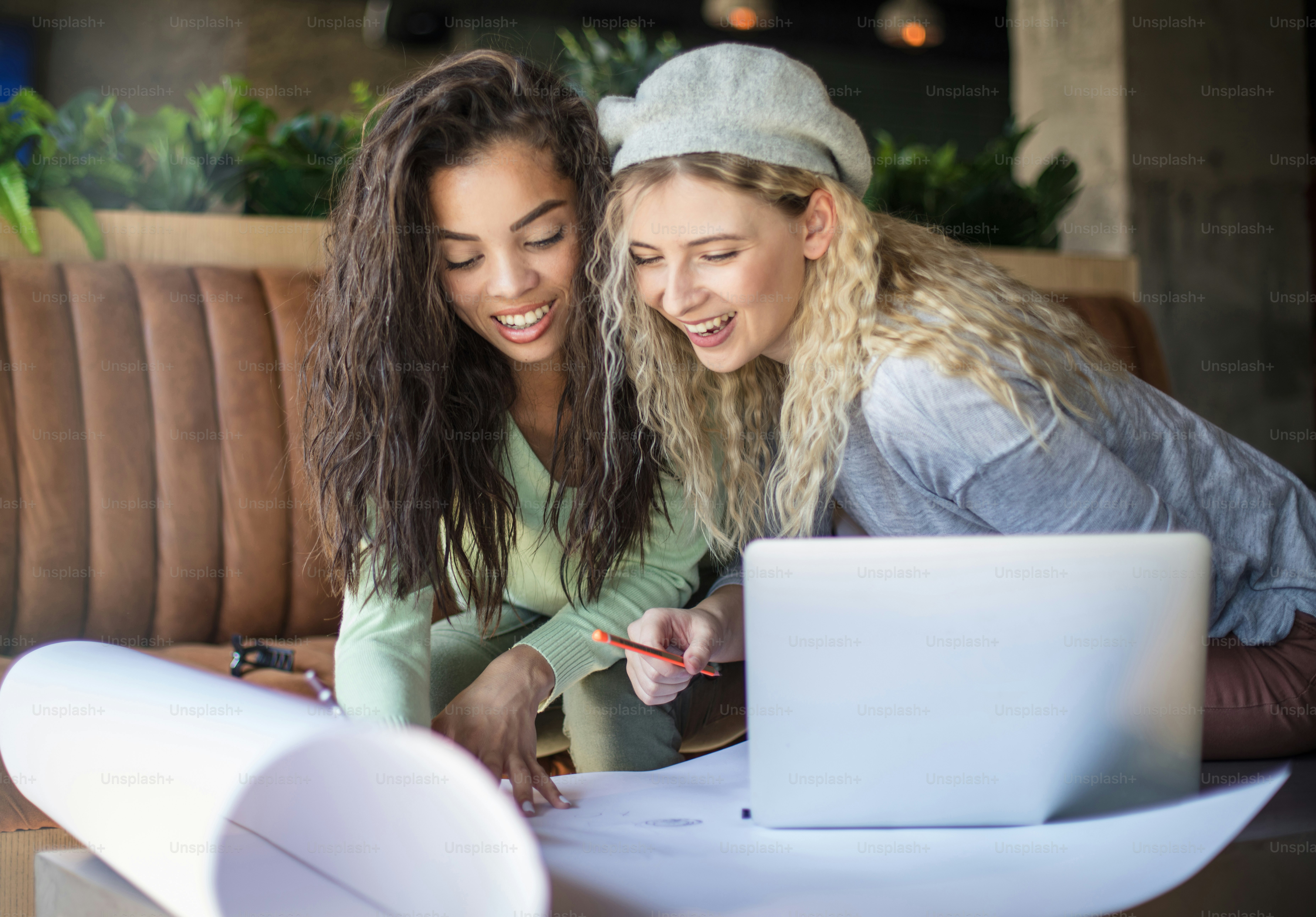 Time for a cafe study session. Two students girls learning together ...