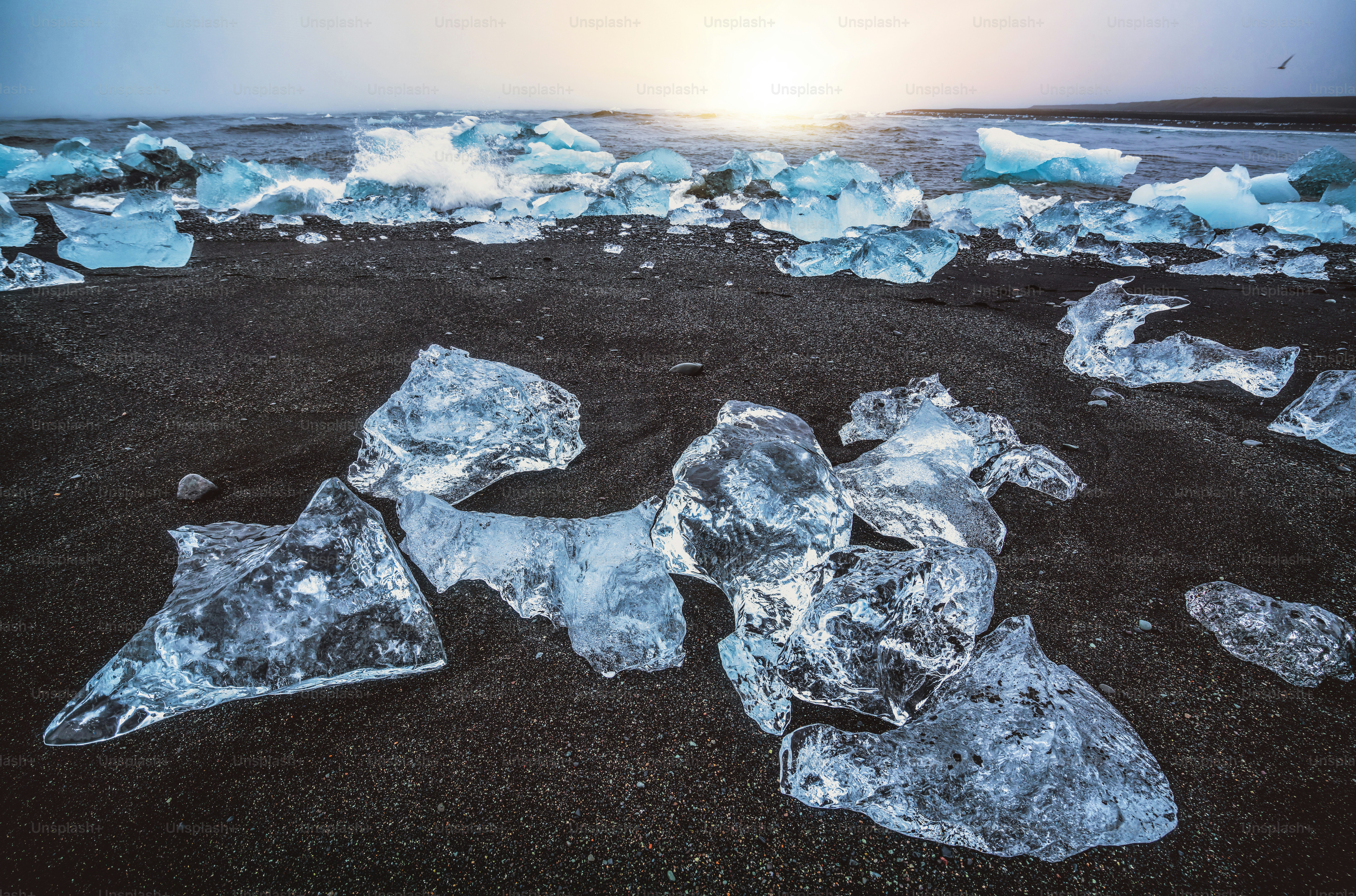 Icebergs on Diamond Beach in Iceland. Frozen ice on black sand beach ...