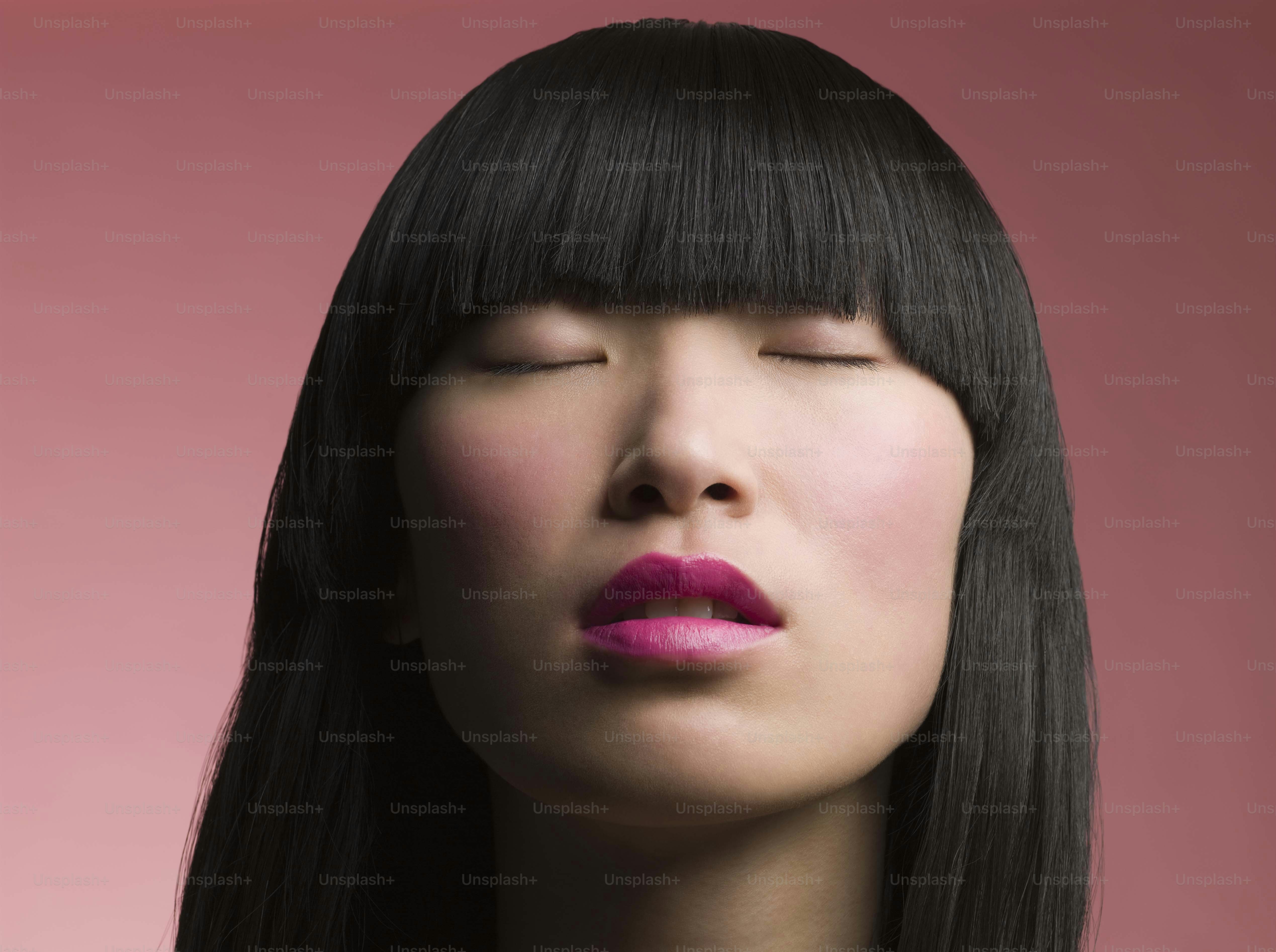 A woman with her eyes closed with her eyes closed photo – Portrait ...