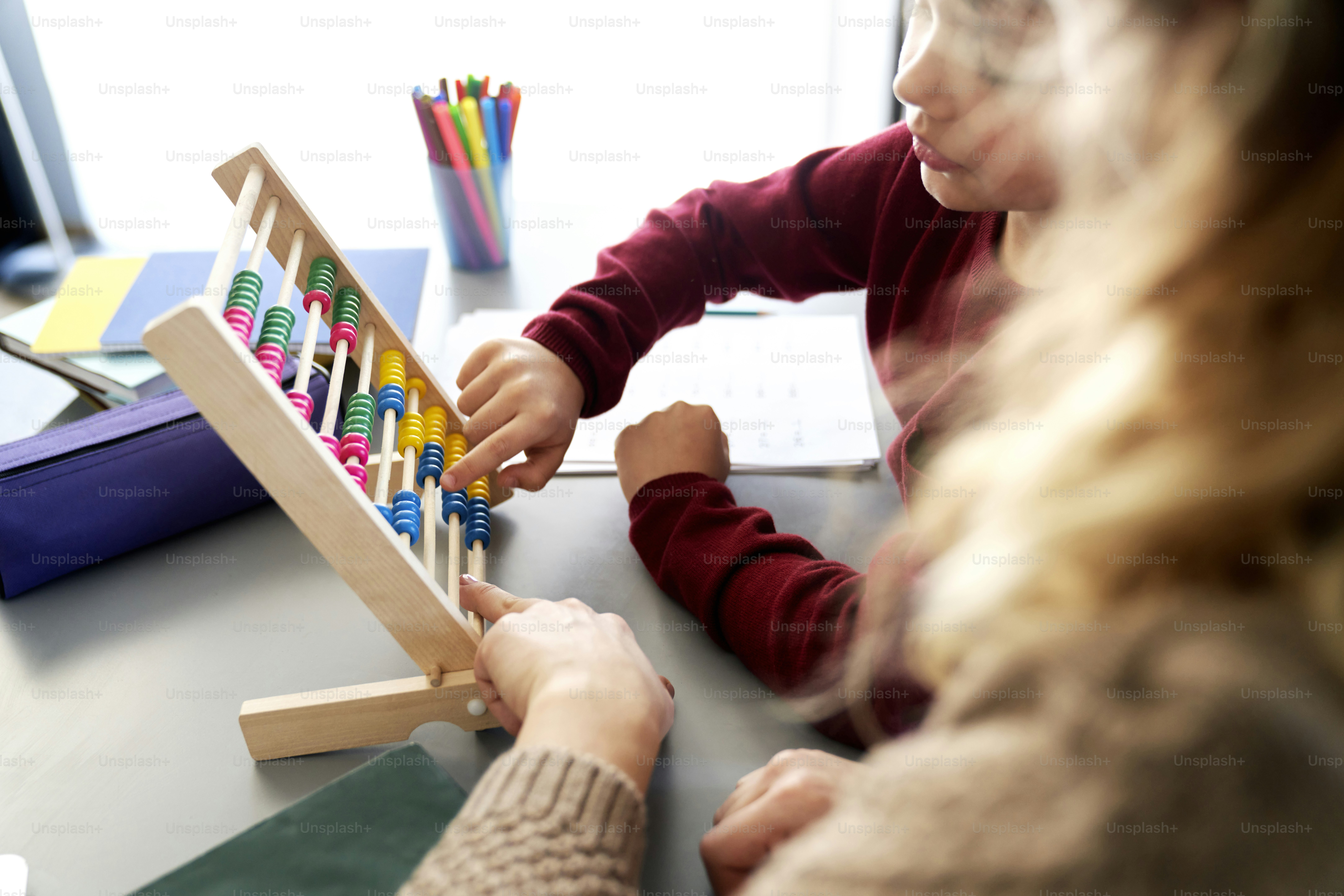 Side view of boy learns to count with an abacus photo – Counting Image ...