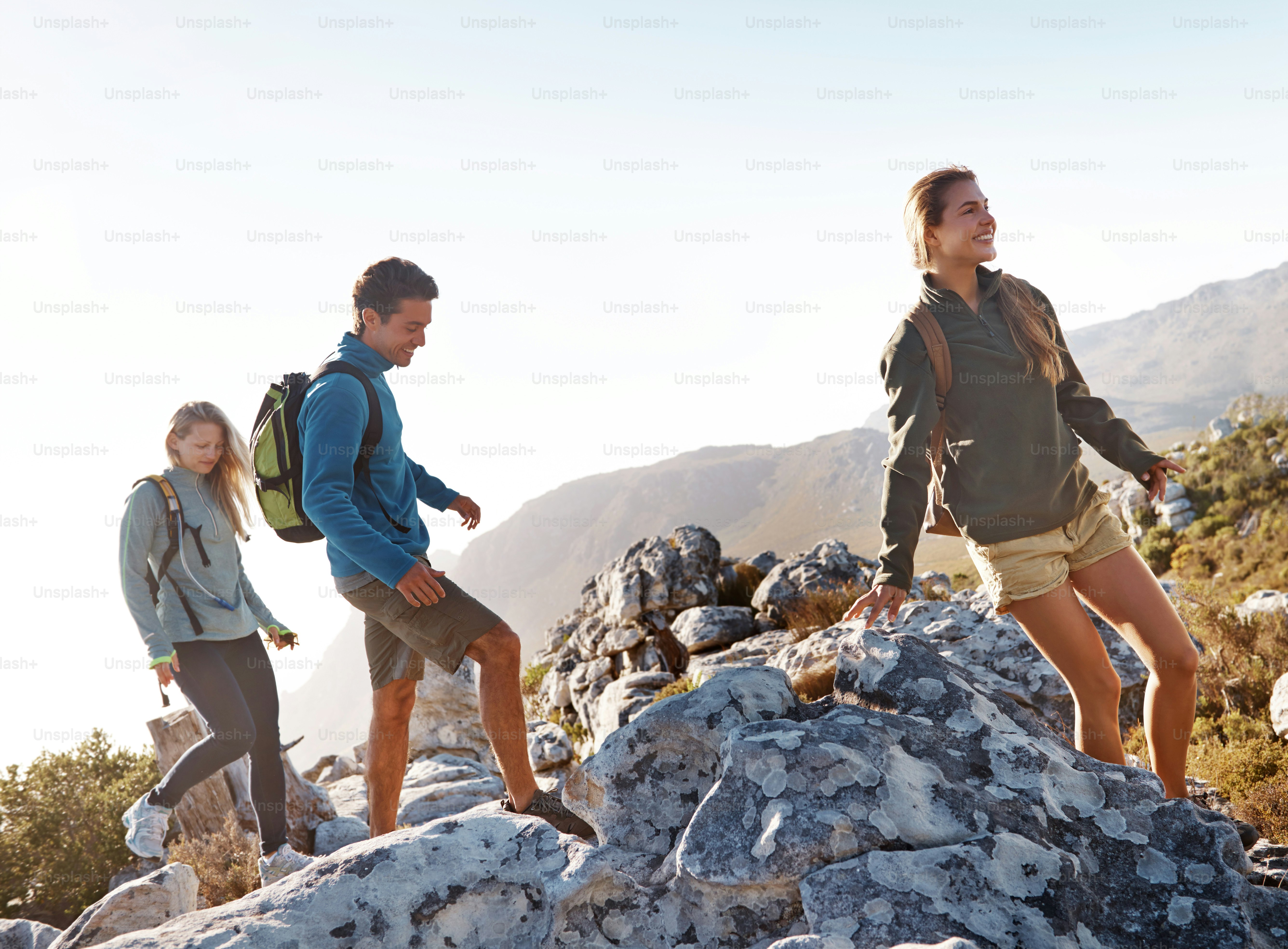 Three friends hiking in the mountains photo – Hiking Image on Unsplash