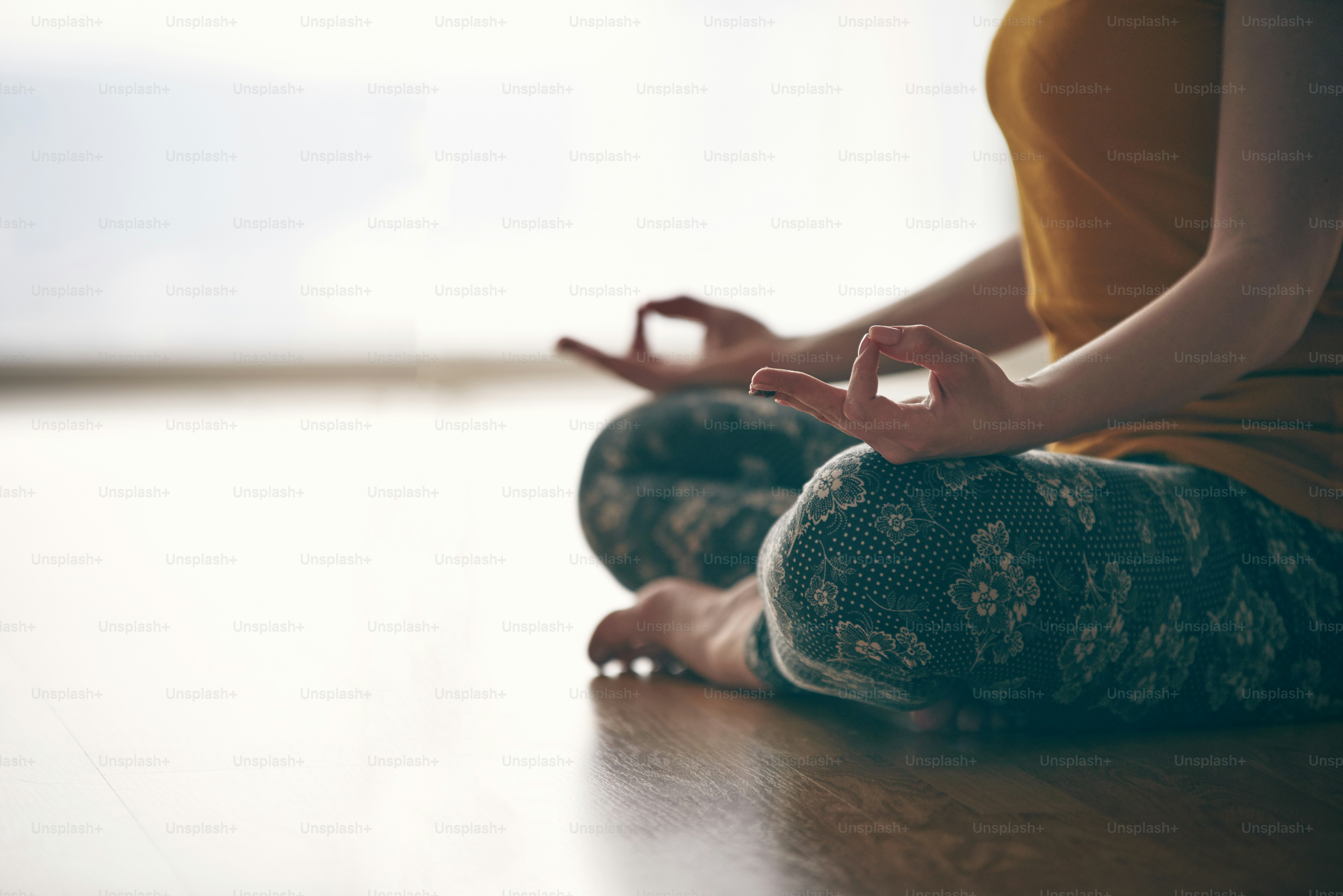 Close up in selective focus of female hands gesture mudra, while doing ...