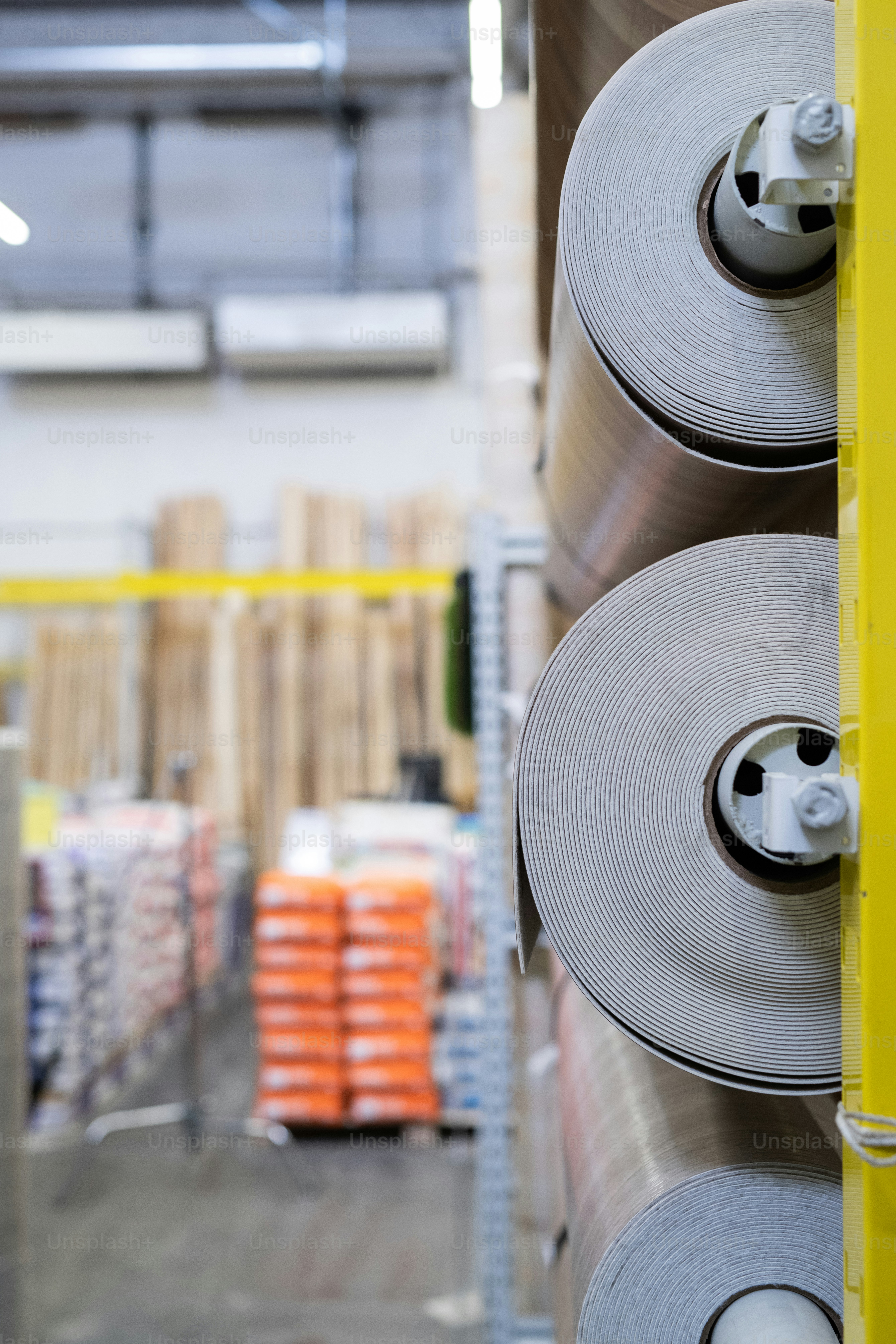 Rolled linoleum on display inside huge contemporary warehouse photo ...