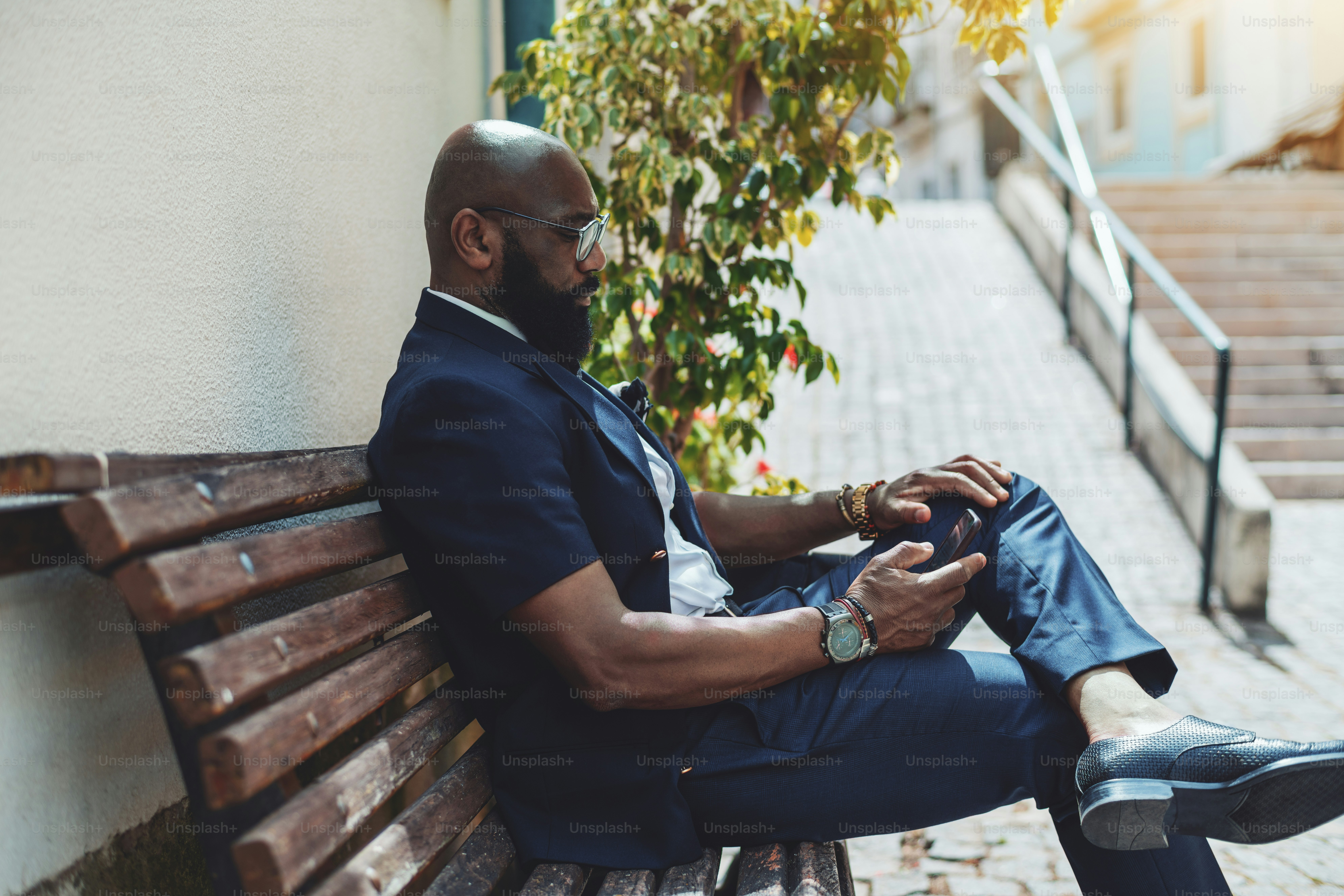 A side view of a mature bald dapper African-American man entrepreneur ...