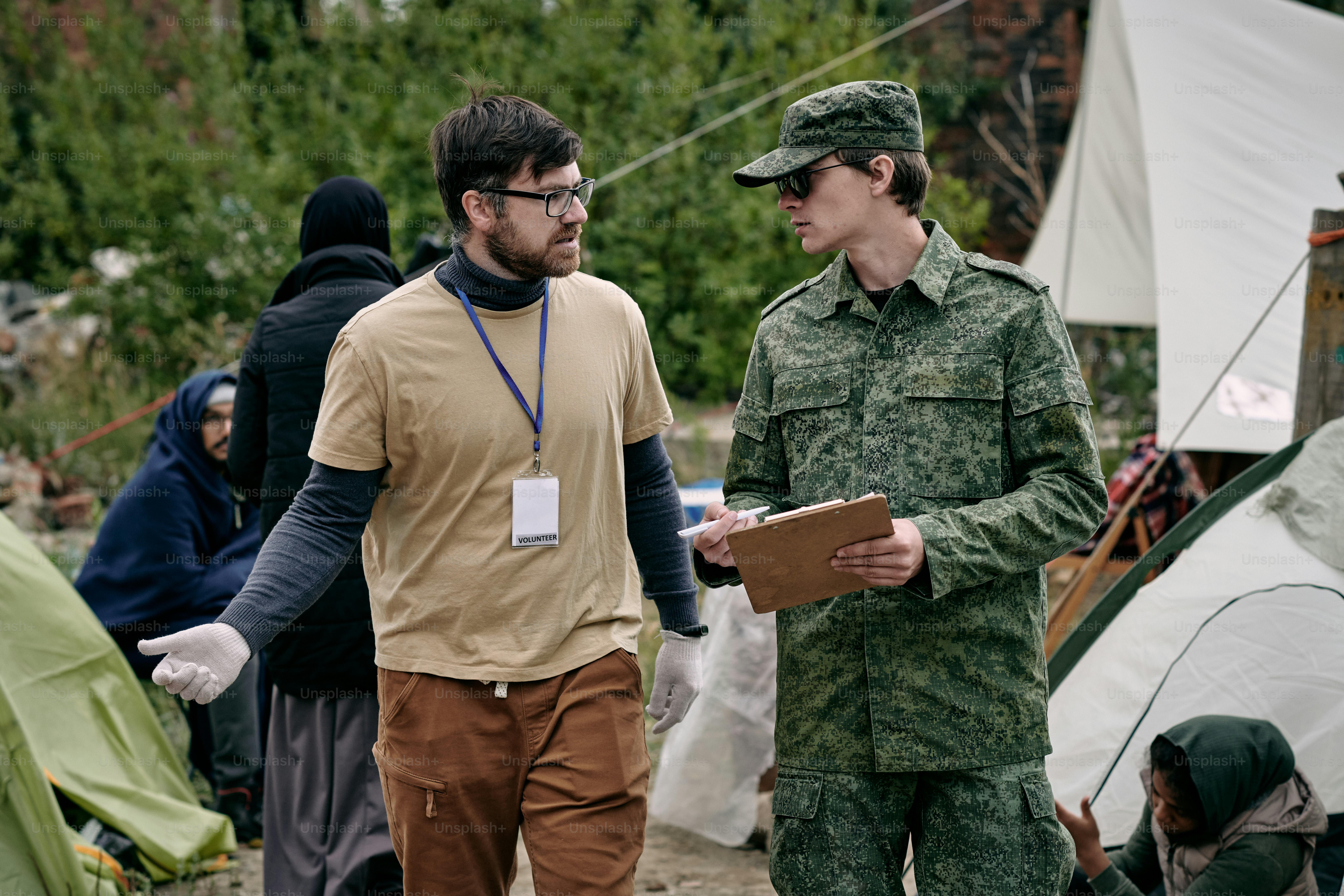 Male volunteer and representative of migration support service ...