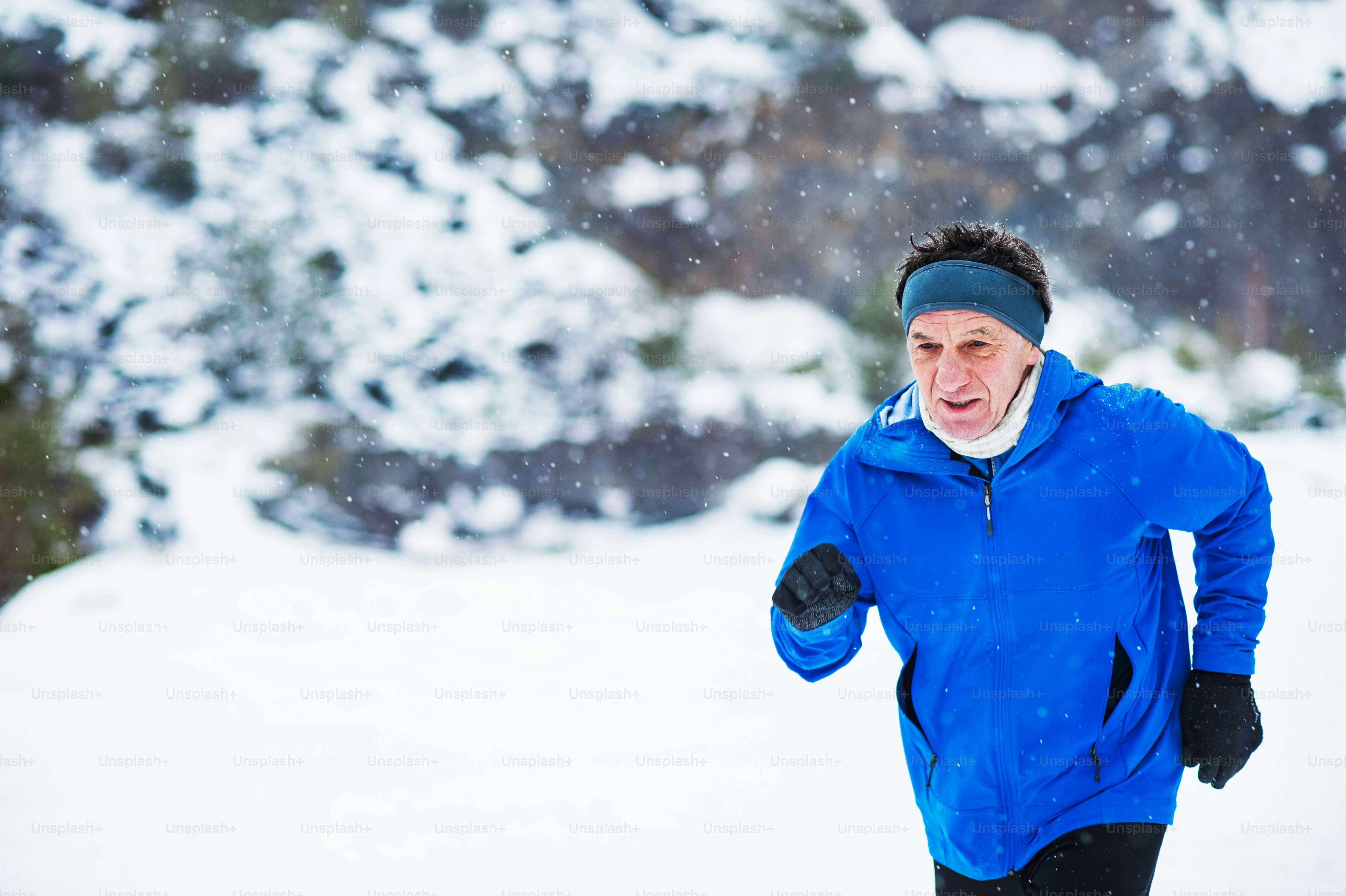 Senior man jogging outside in winter nature. Copy space. photo ...