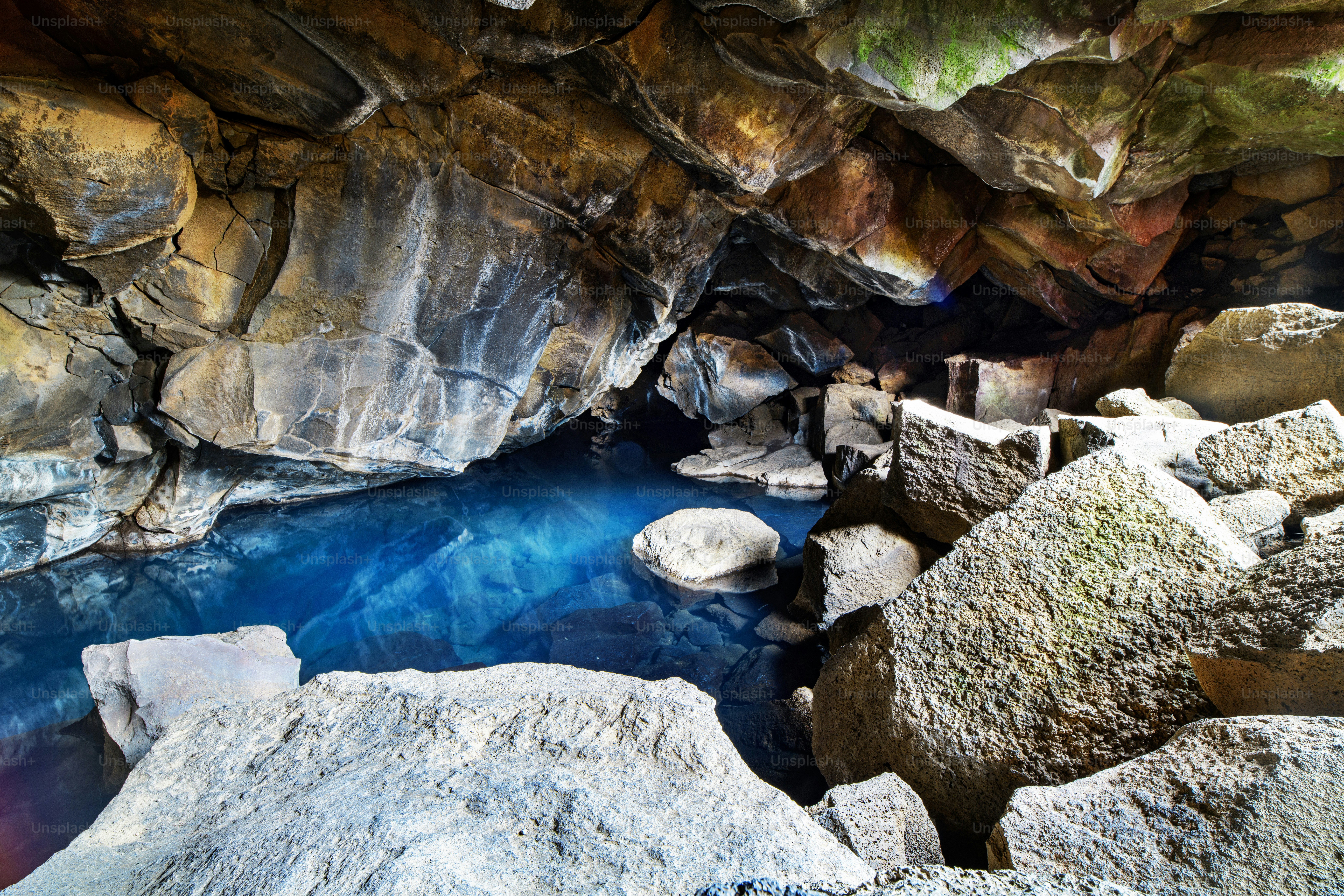 A cave filled with hot water in Iceland, Europe. photo – Cave Image on ...