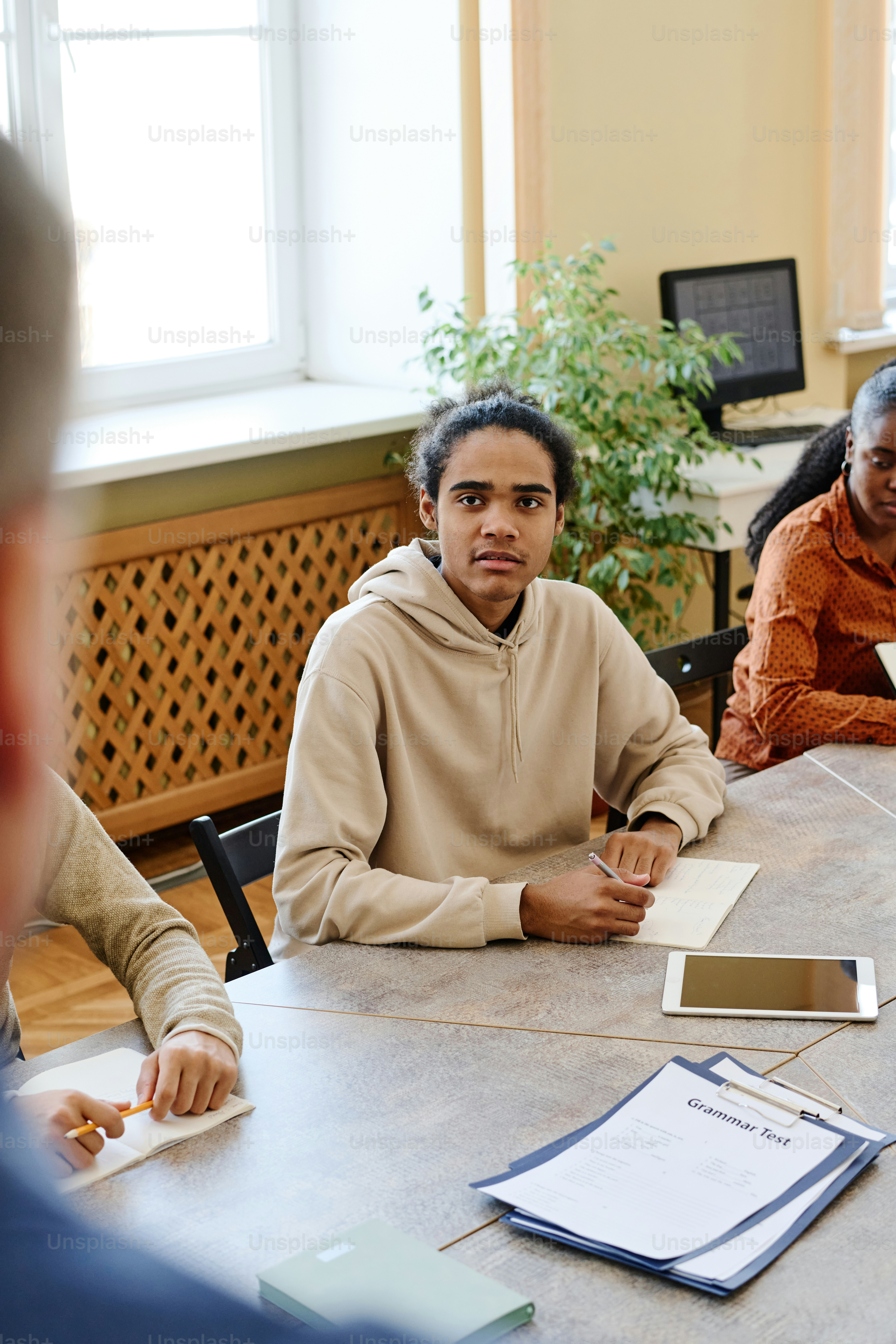 Young Black student attending language classes for immigrants ...