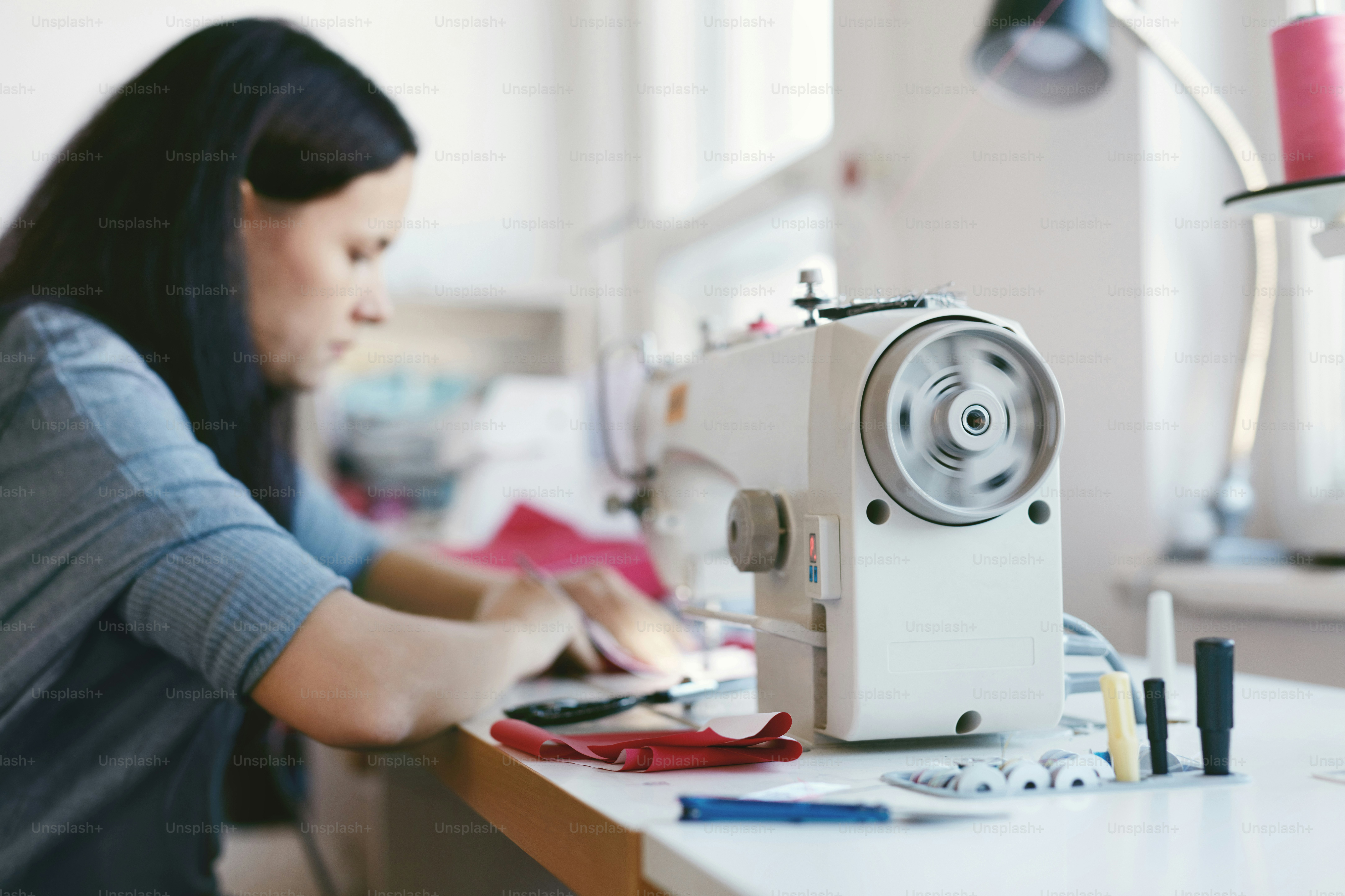 Female Working On Sewing Machine. Portrait Of Woman Tailor Sewing ...