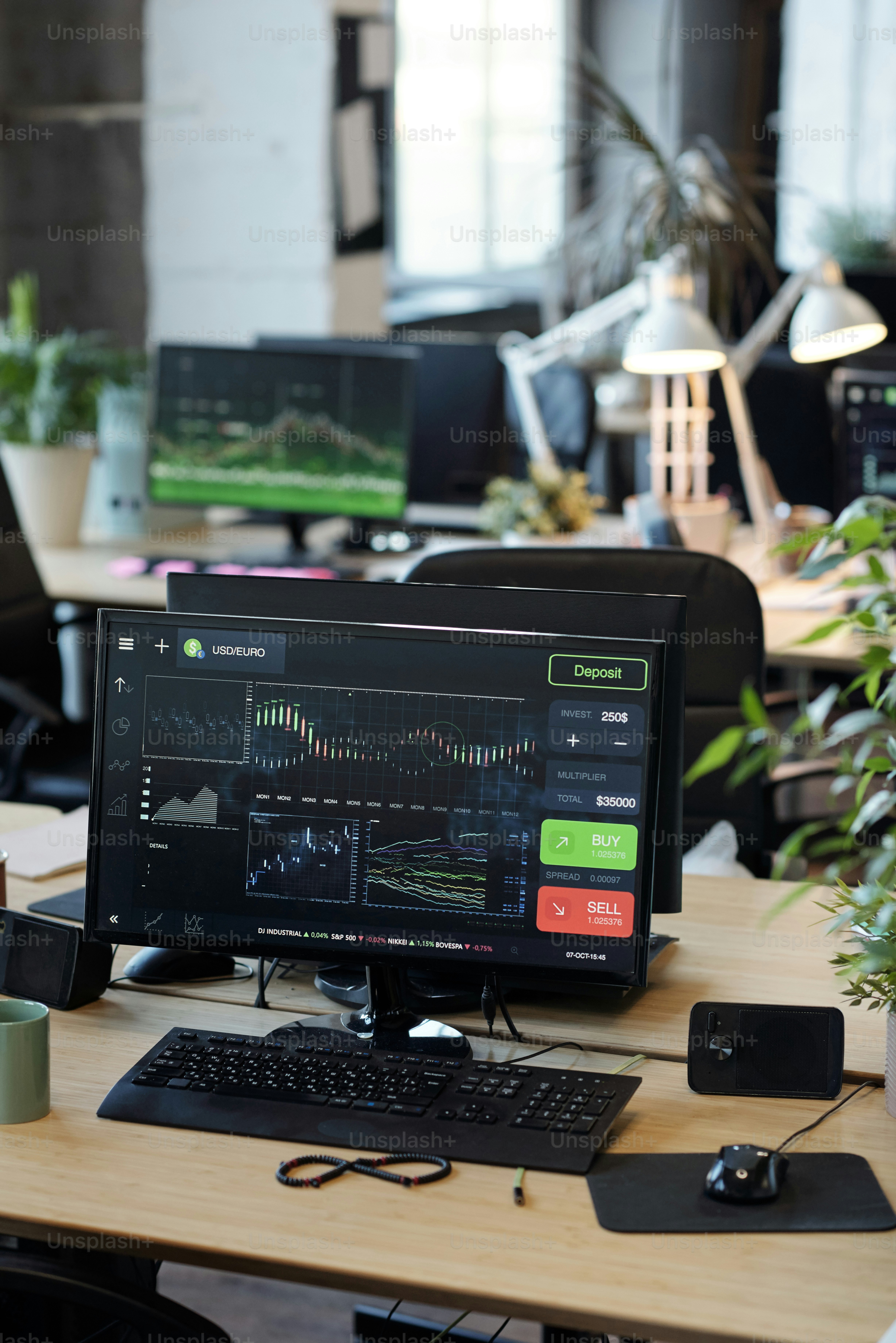 Computer monitor with graphic online information standing on desk photo ...