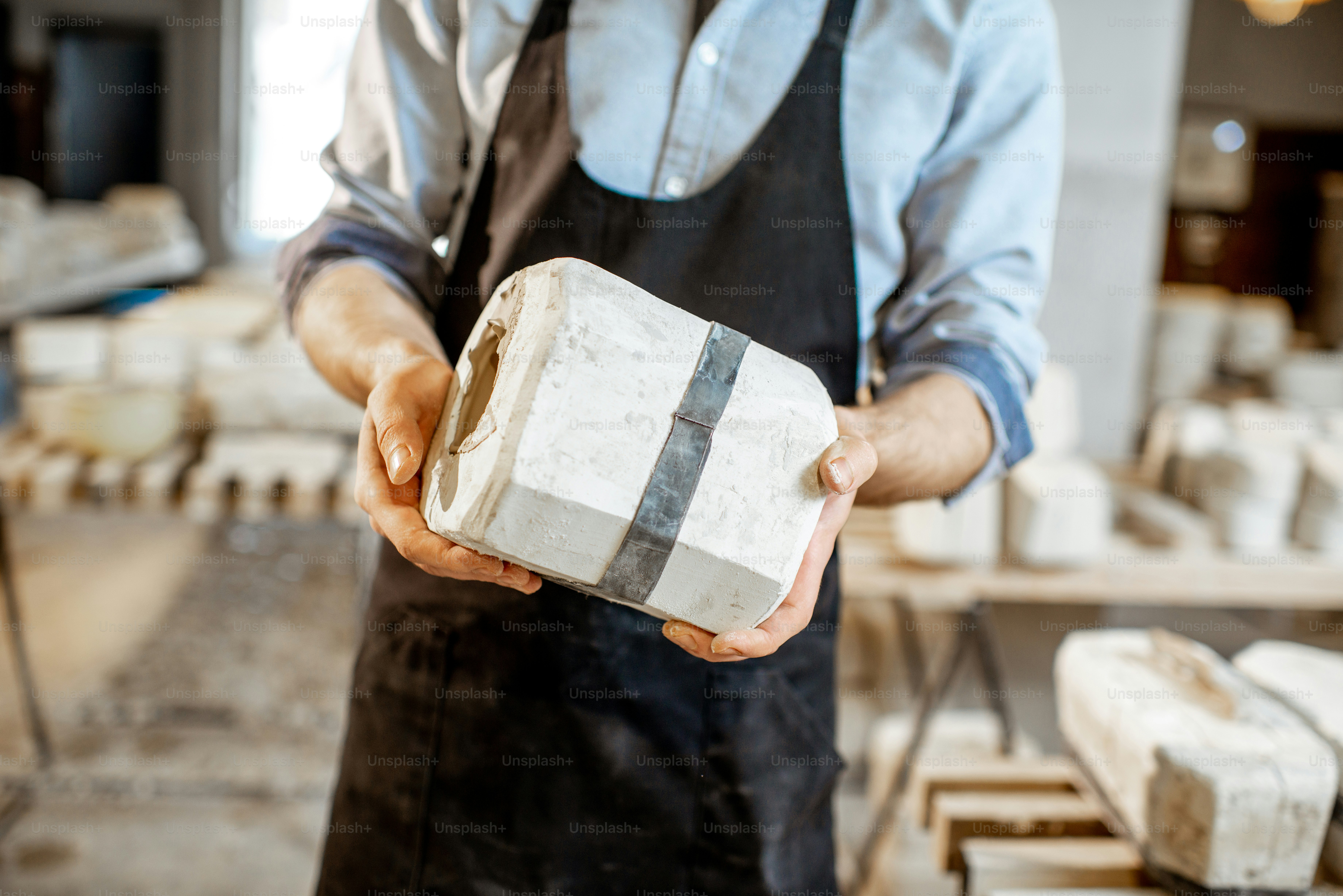 Man holding gypsum form at the pottery manufacturing, close-up view ...