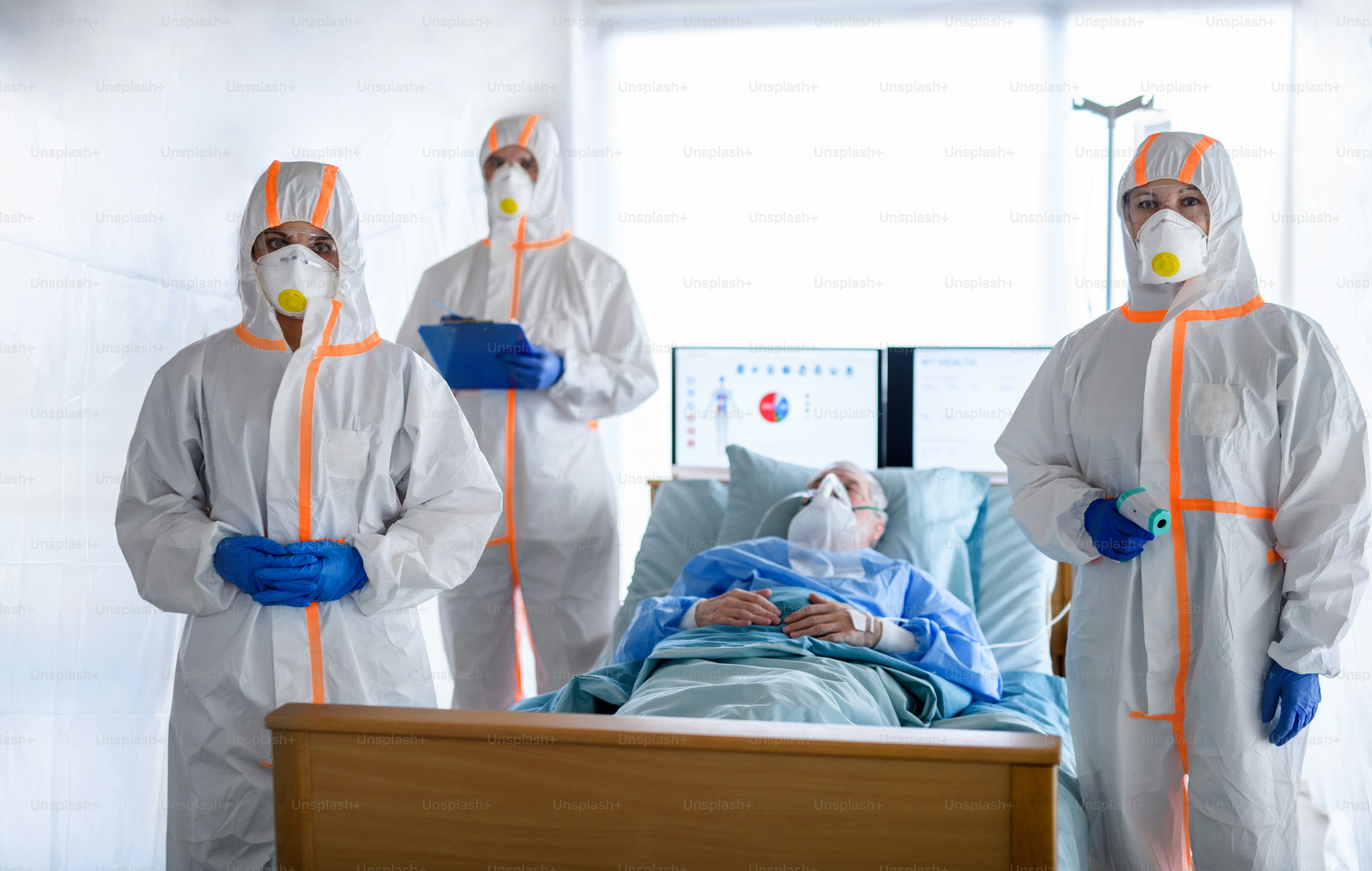 An infected patient in quarantine lying in bed in hospital, coronavirus ...