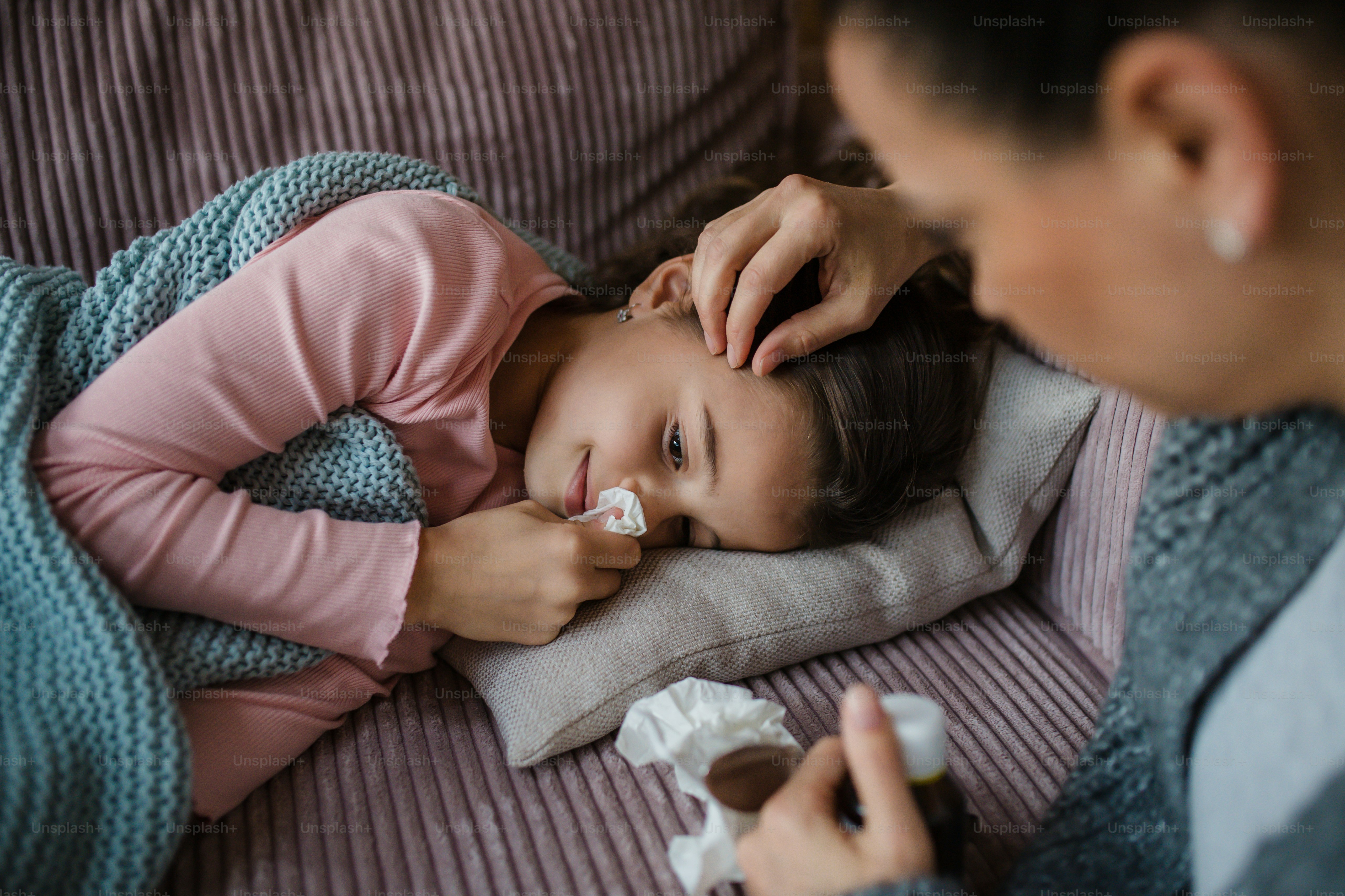 A mother taking care of her sick daughter at home. photo – Sick person ...