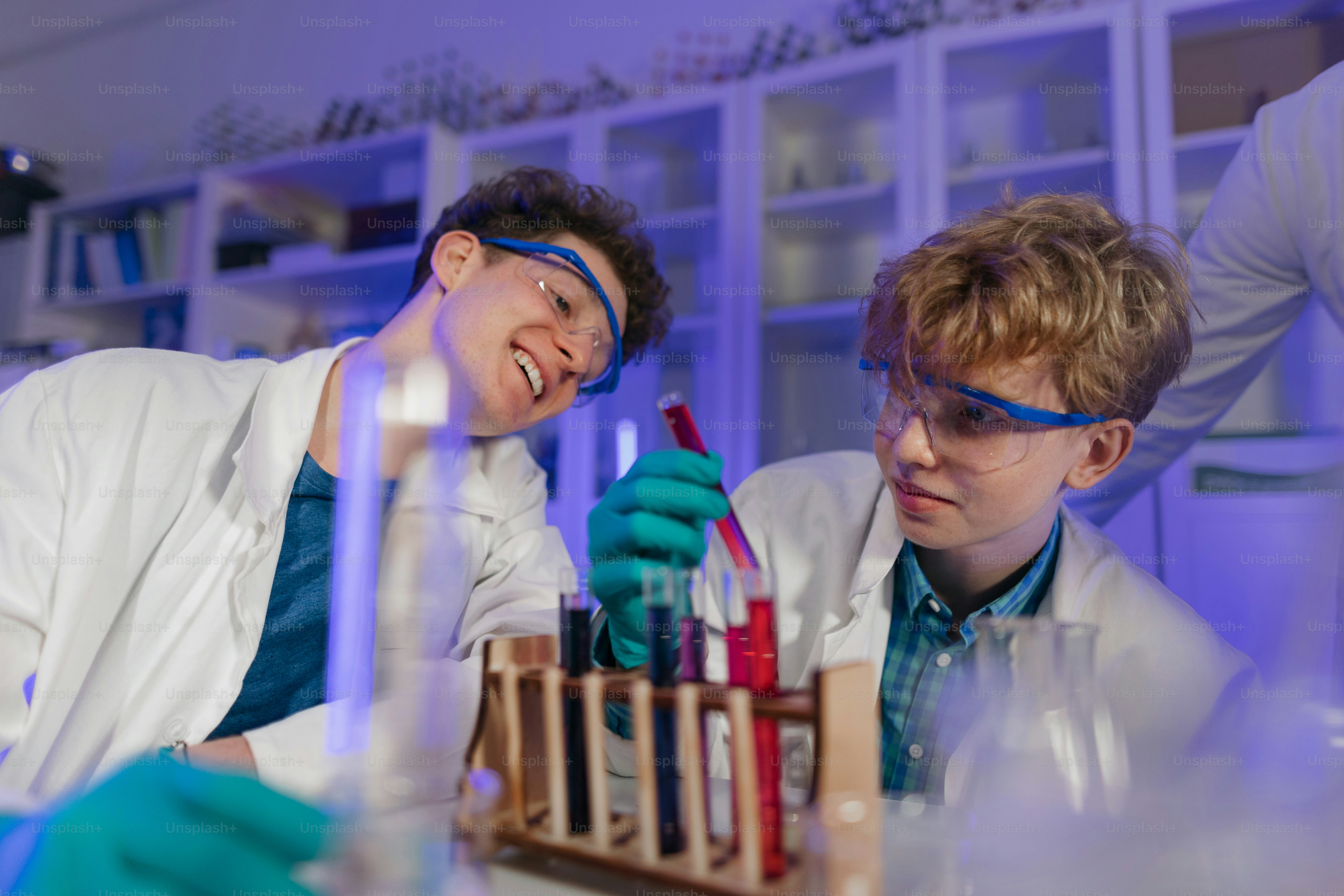 A science student doing chemical experiment in the laboratory at ...