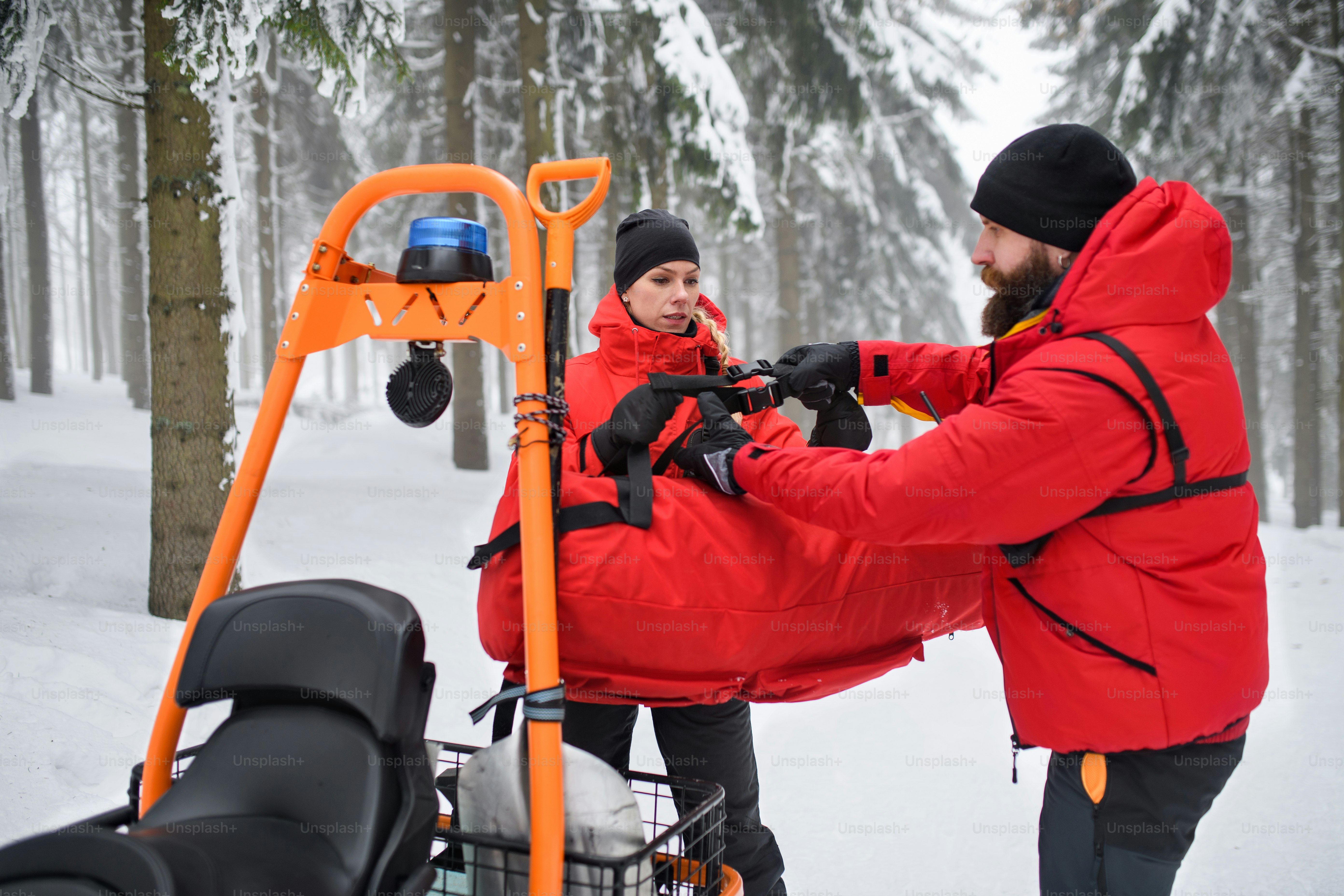 Paramedic woman from mountain rescue service provide an operation ...