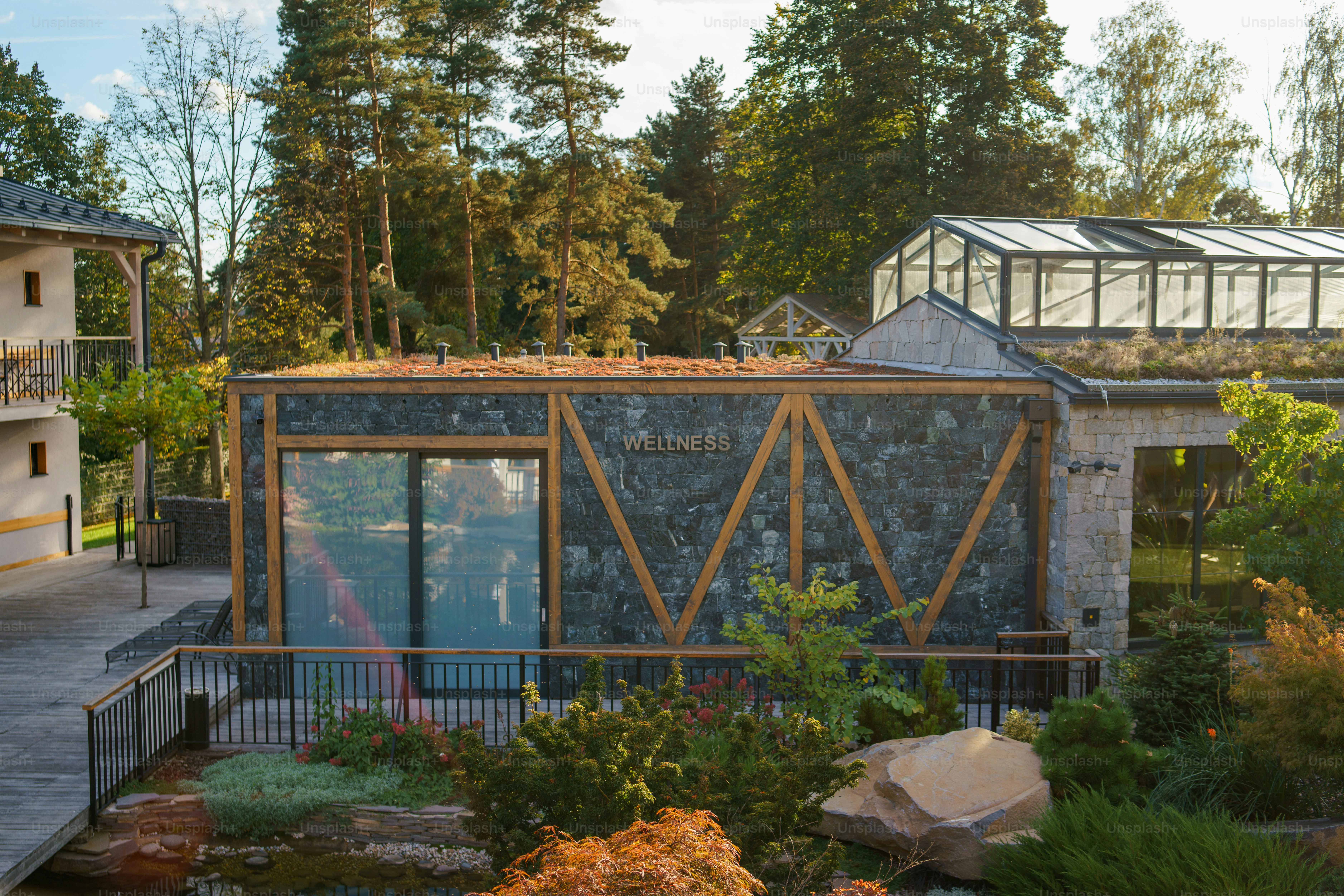 A modern wellness building exterior in luxury hotel garden. photo ...