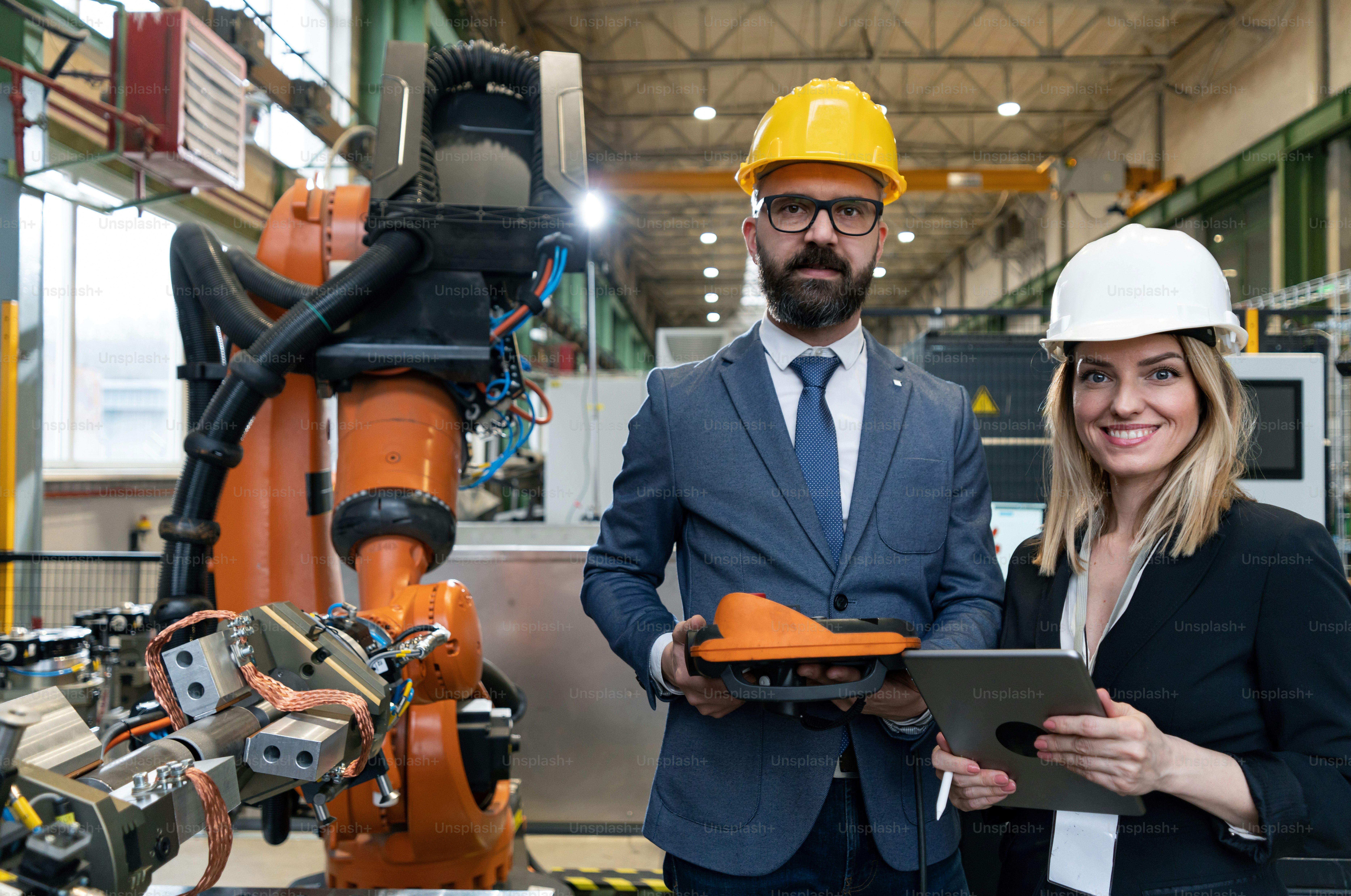 Female engineering manager and mechanic worker inside the factory photo ...