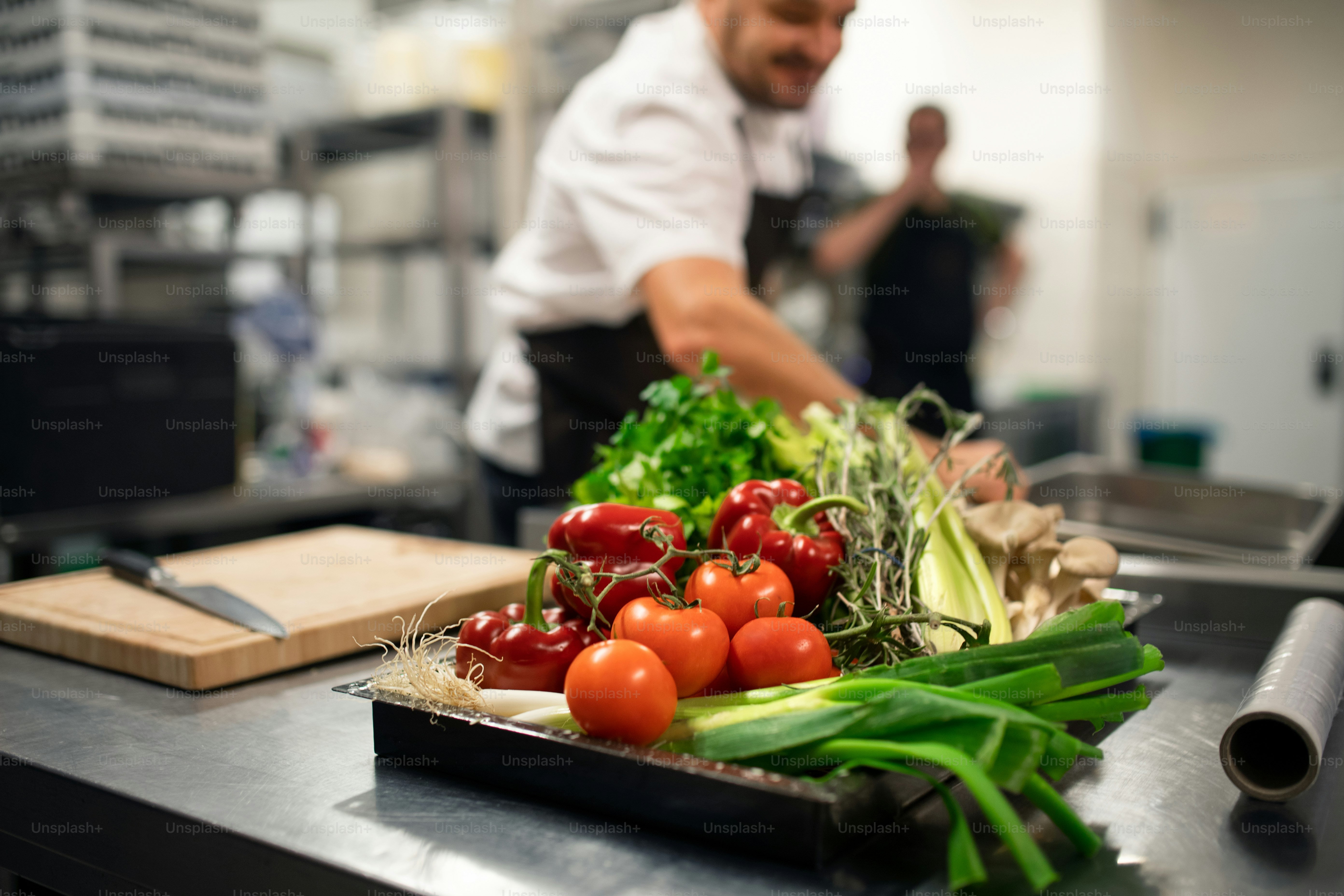 Fresh ripe vegetables prepared for cutting in commercial kitchen. photo ...