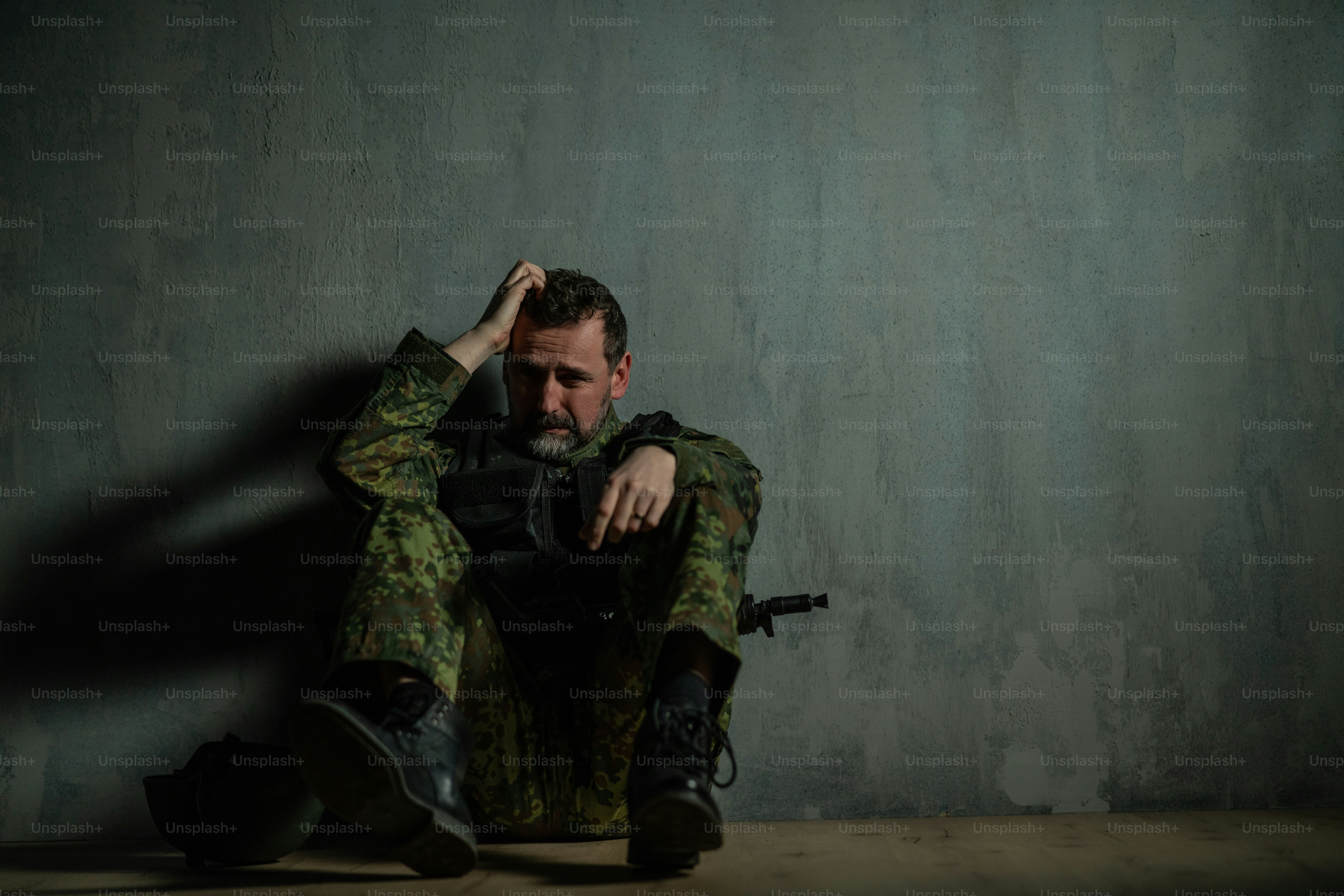 A frustrated military soldier sitting in boot camp photo – Military ...
