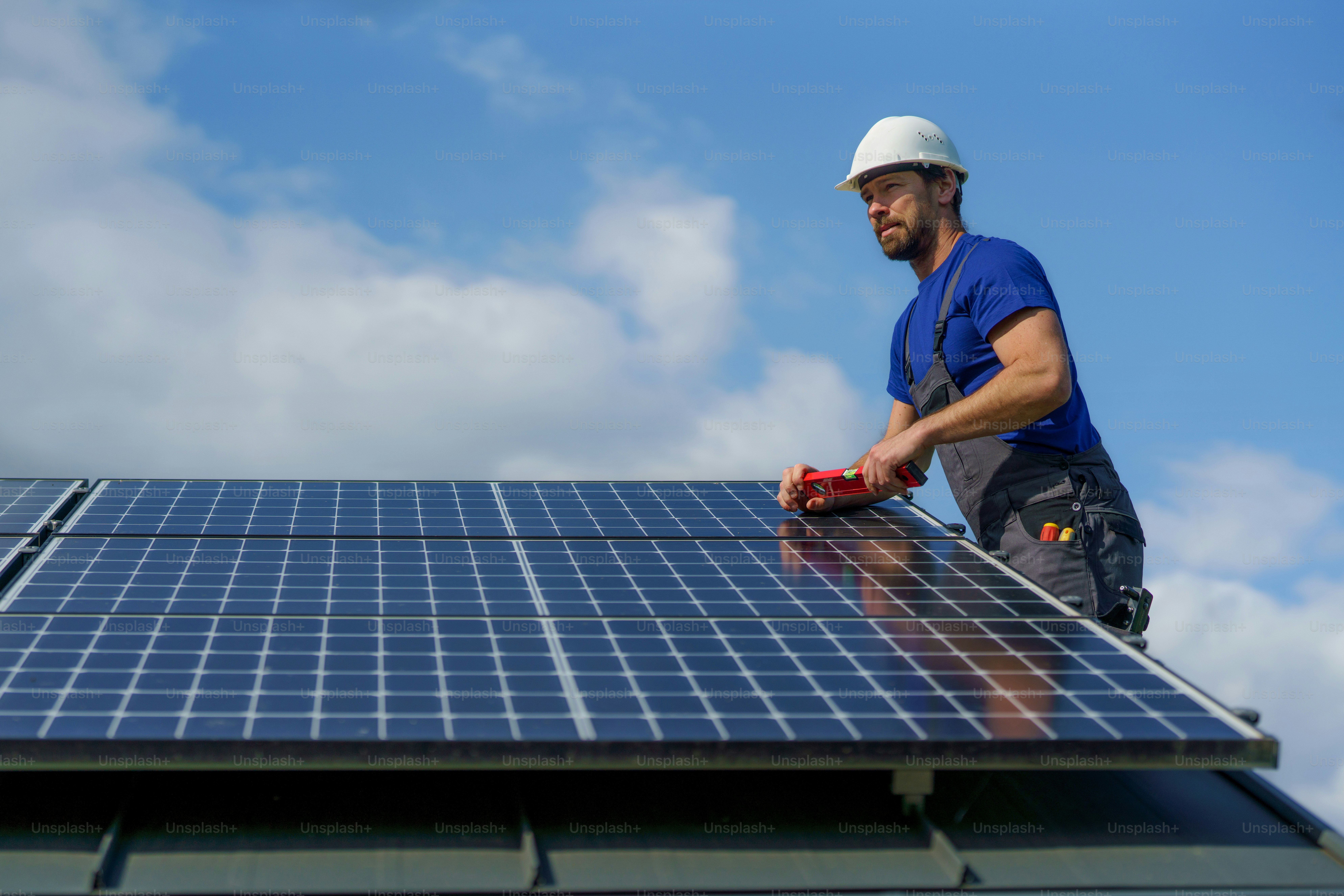 A man worker carrying solar panel for installing solar modul system on ...