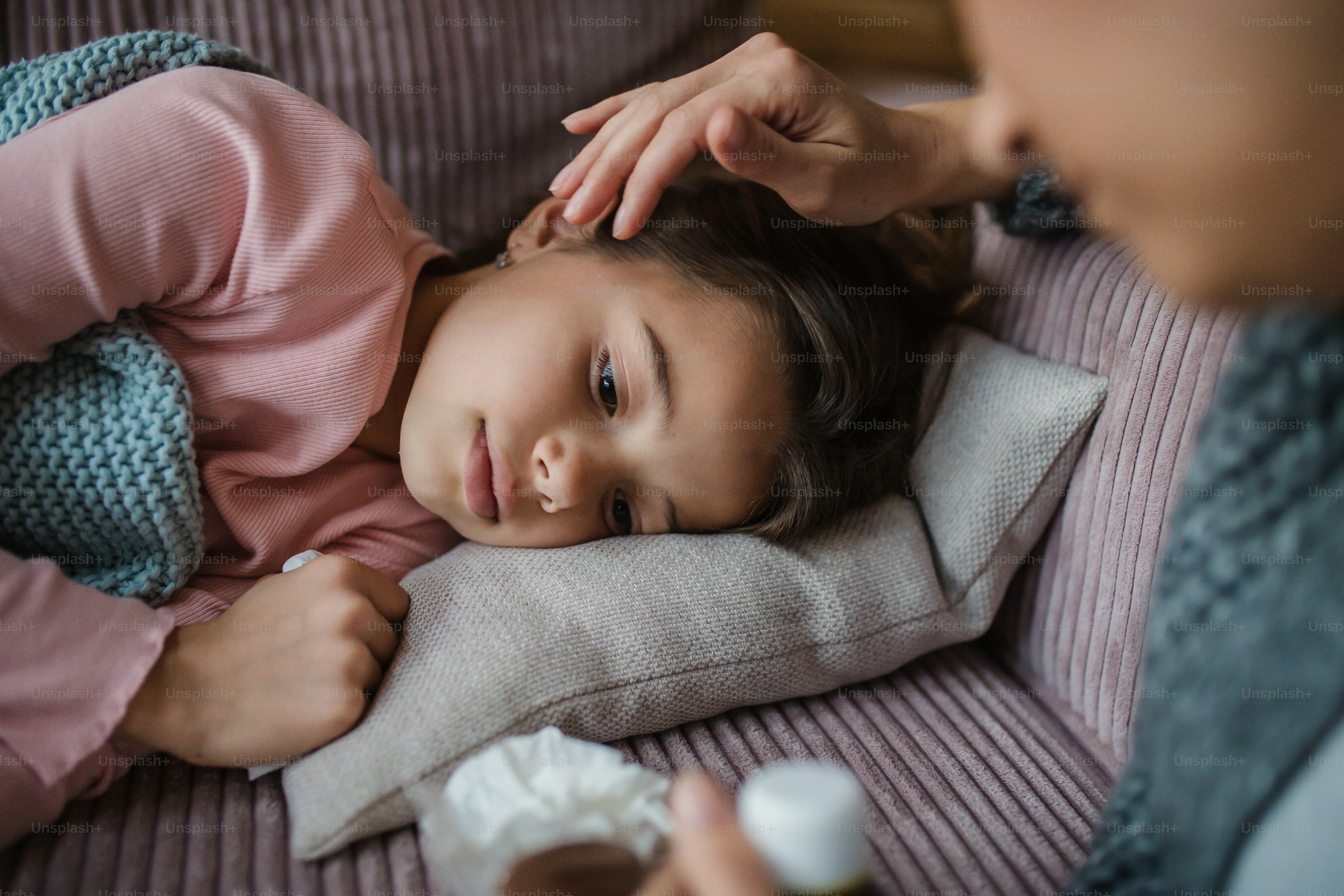A mother taking care of her sick daughter at home. photo – Kindness ...