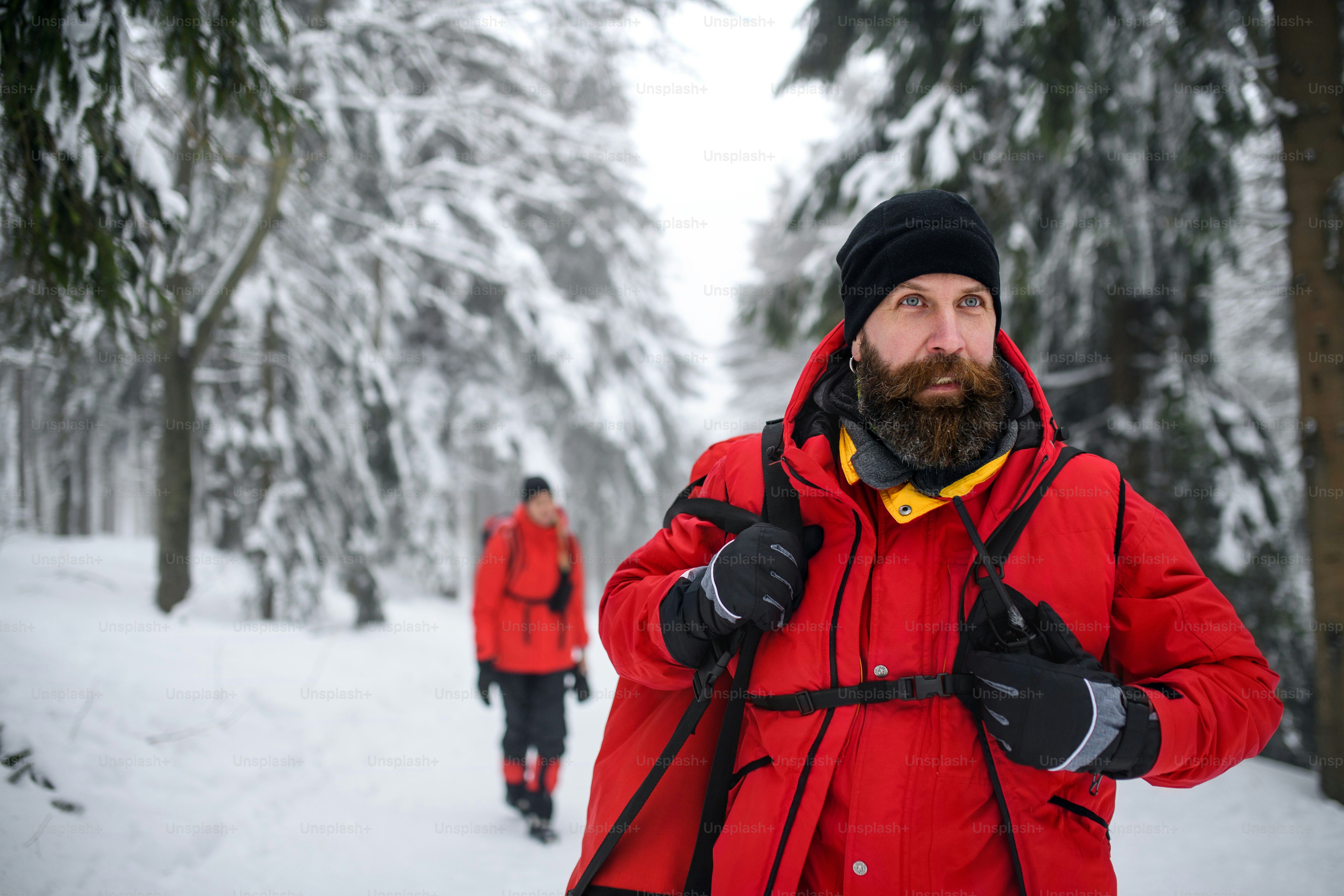 Paramedic man from mountain rescue service with walkie talkie outdoors ...