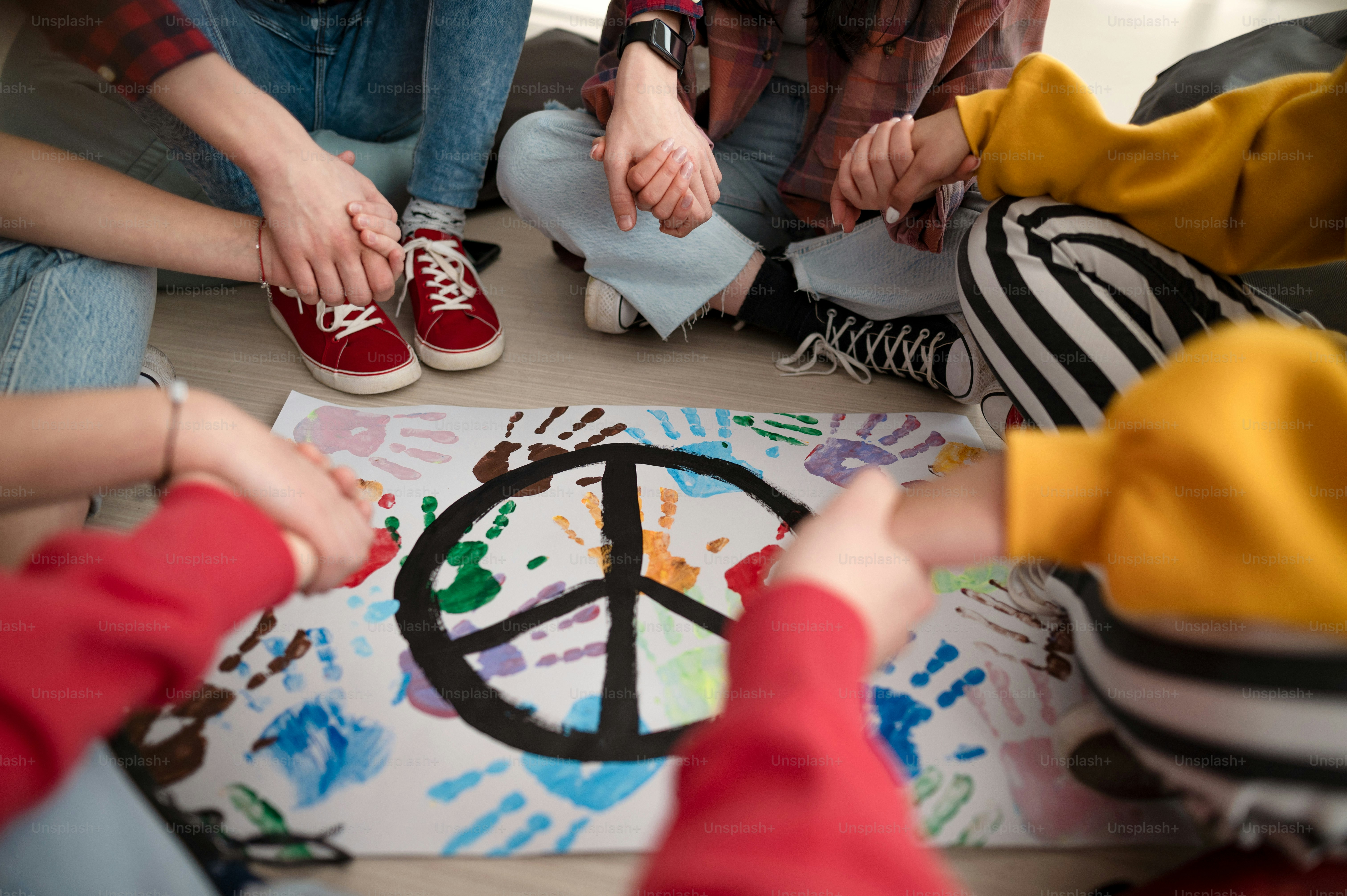 A top view of students making a poster of peace sign at school. photo ...