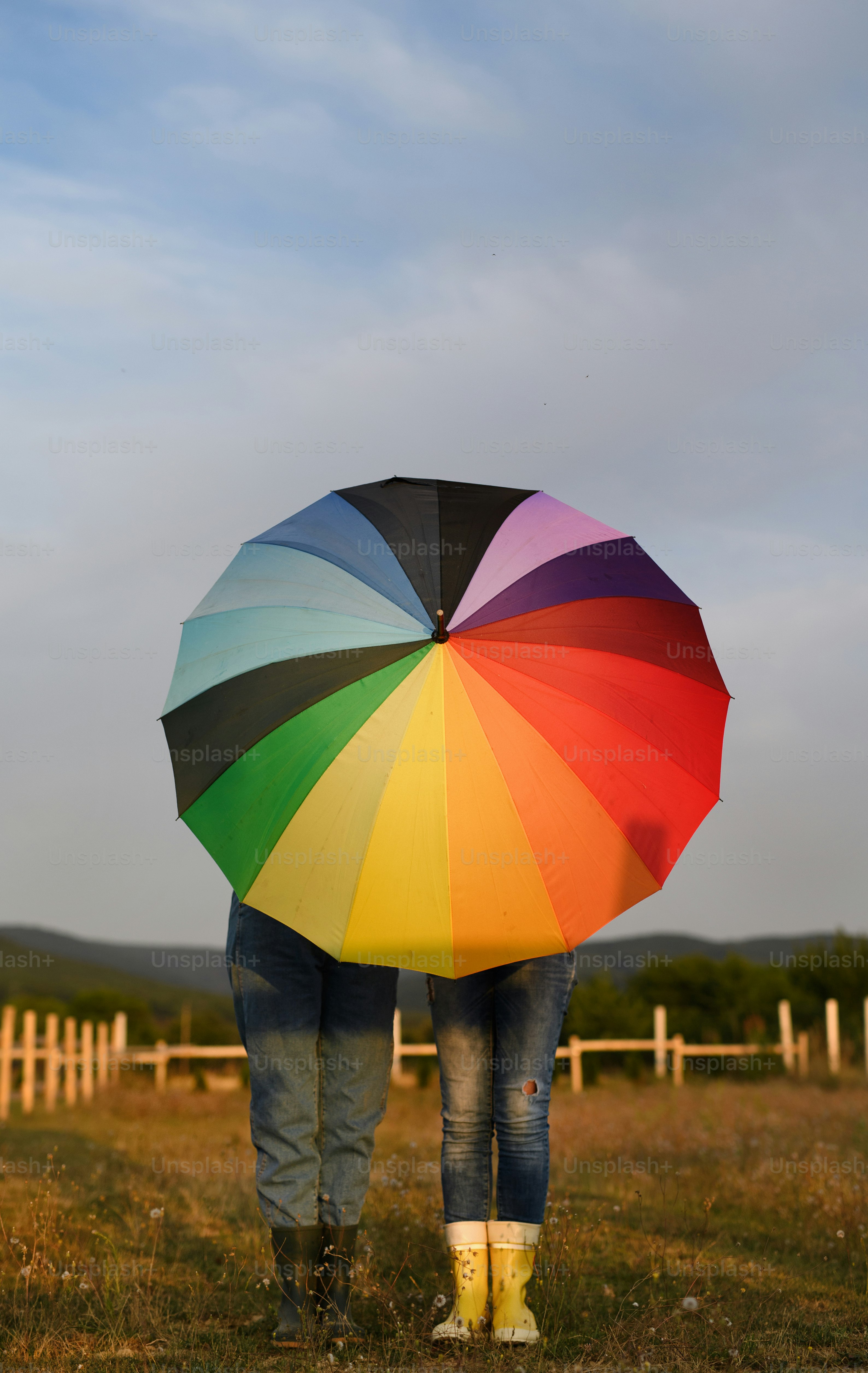 A happy farmer family holding umbrella outdoors in garden. photo ...