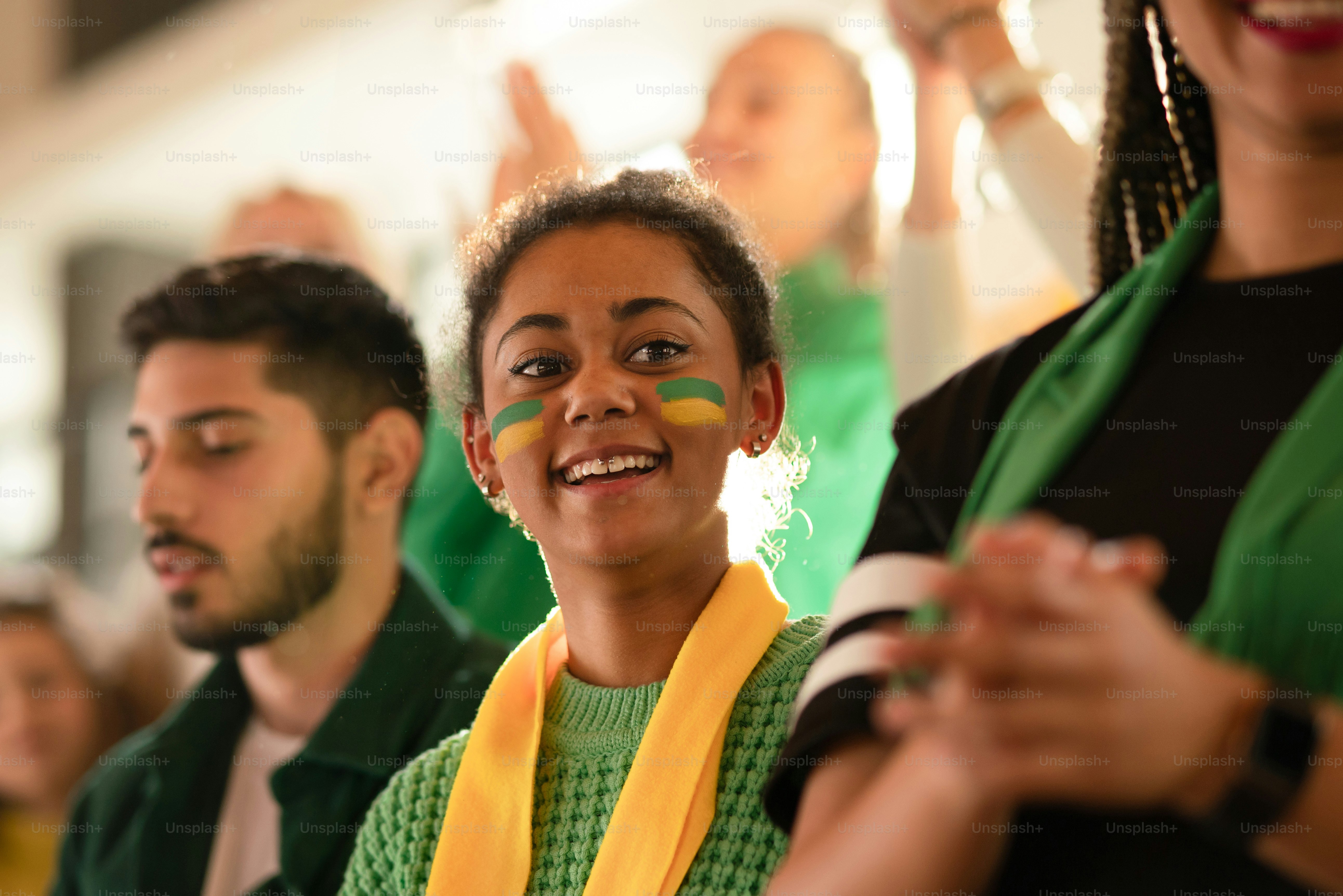 Brazilian young sisters football fans supporting their team at a ...