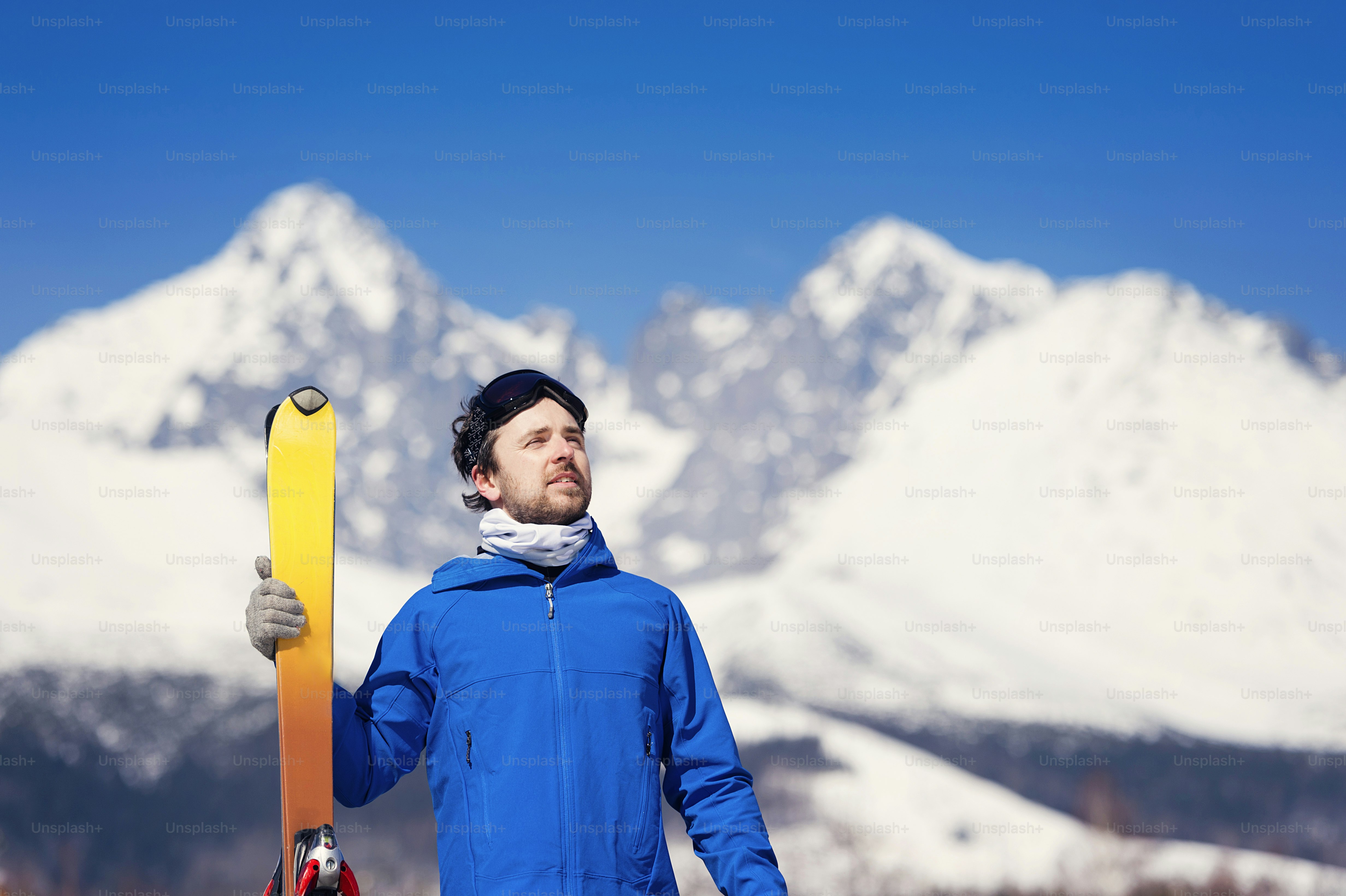 Young couple skiing outside in sunny winter mountains photo – Mountain ...
