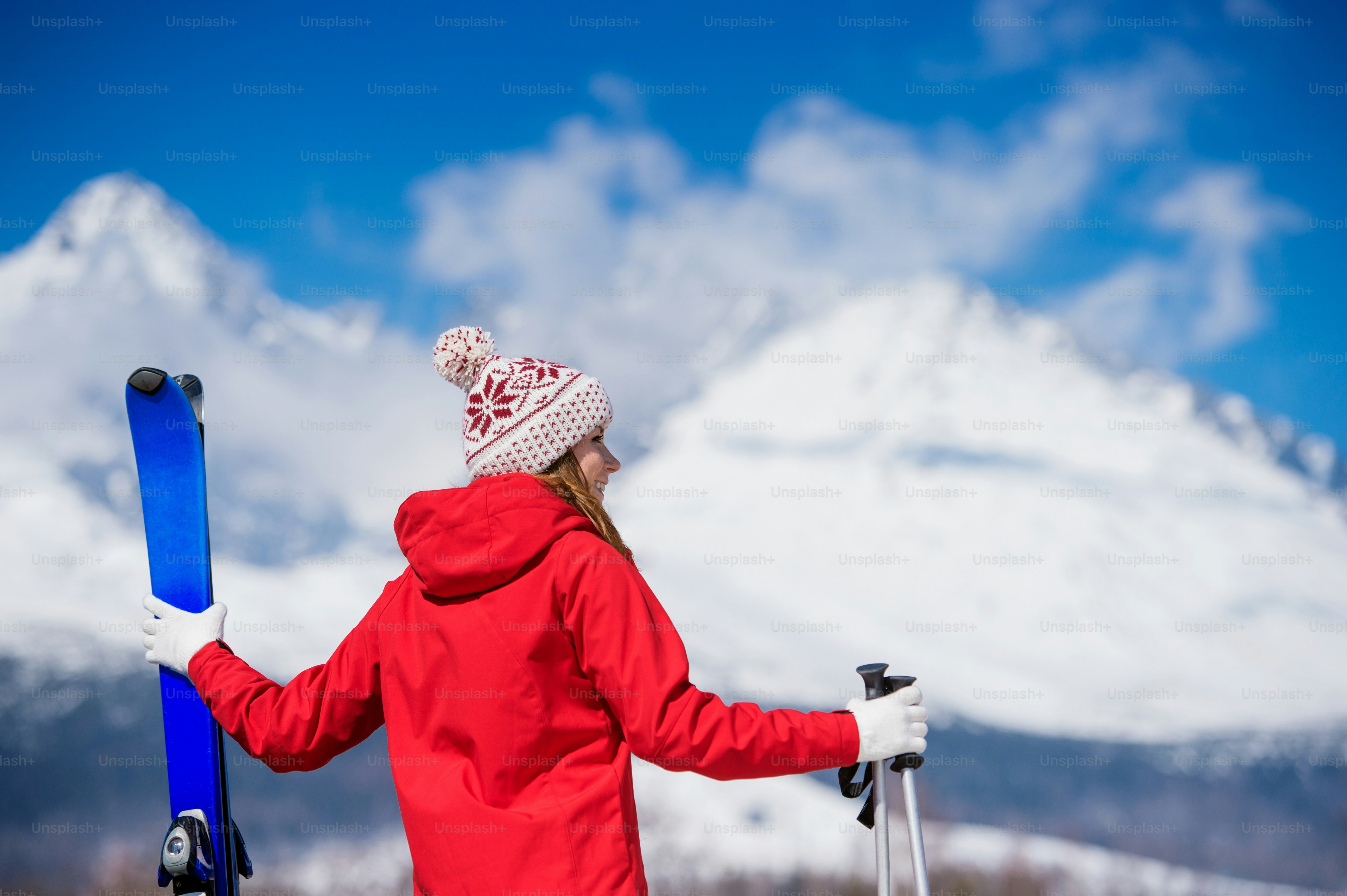Young woman skiing outside in sunny winter mountains photo – Exercising ...