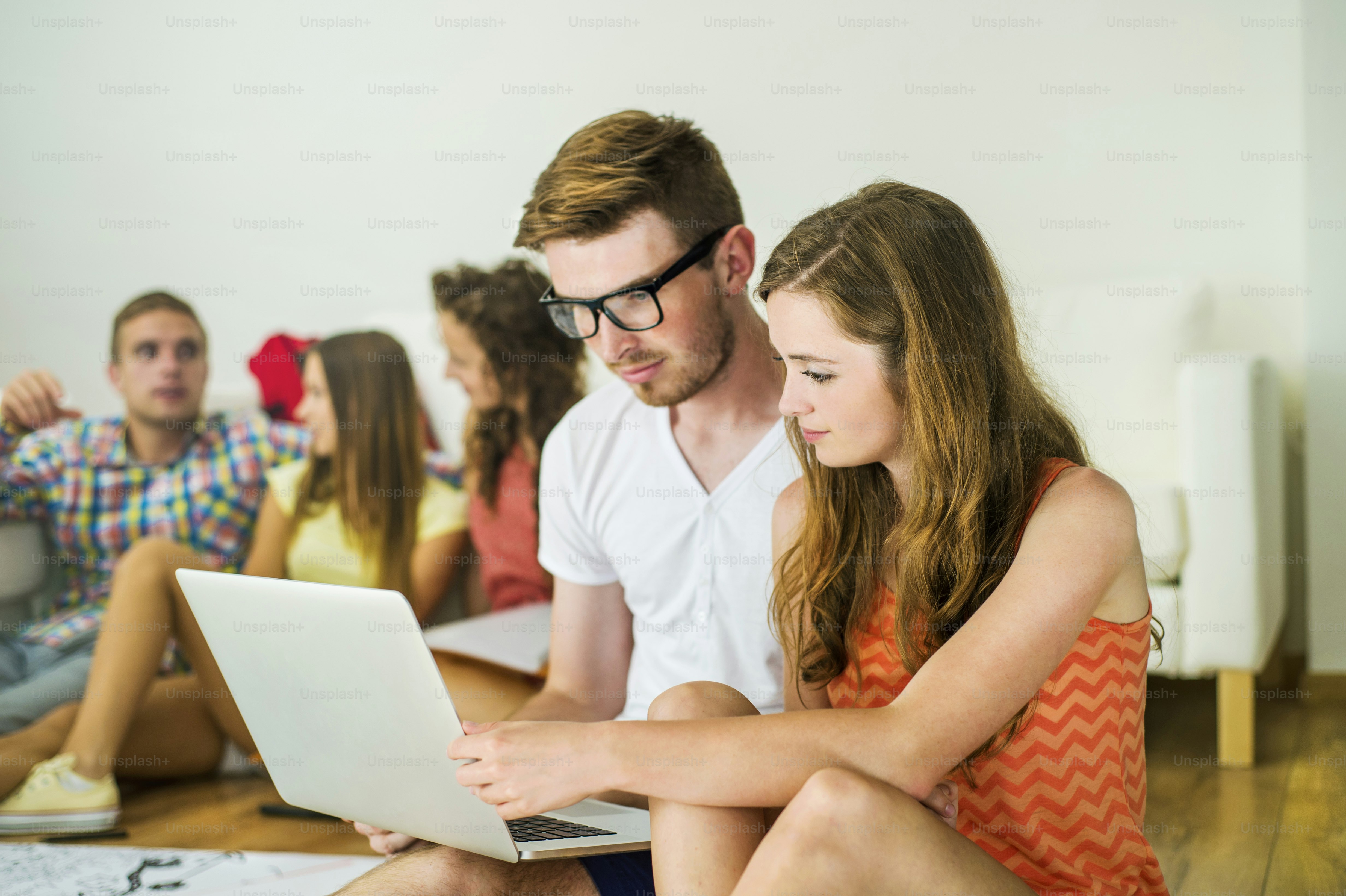 Group of young students studying together and preparing for exams in ...