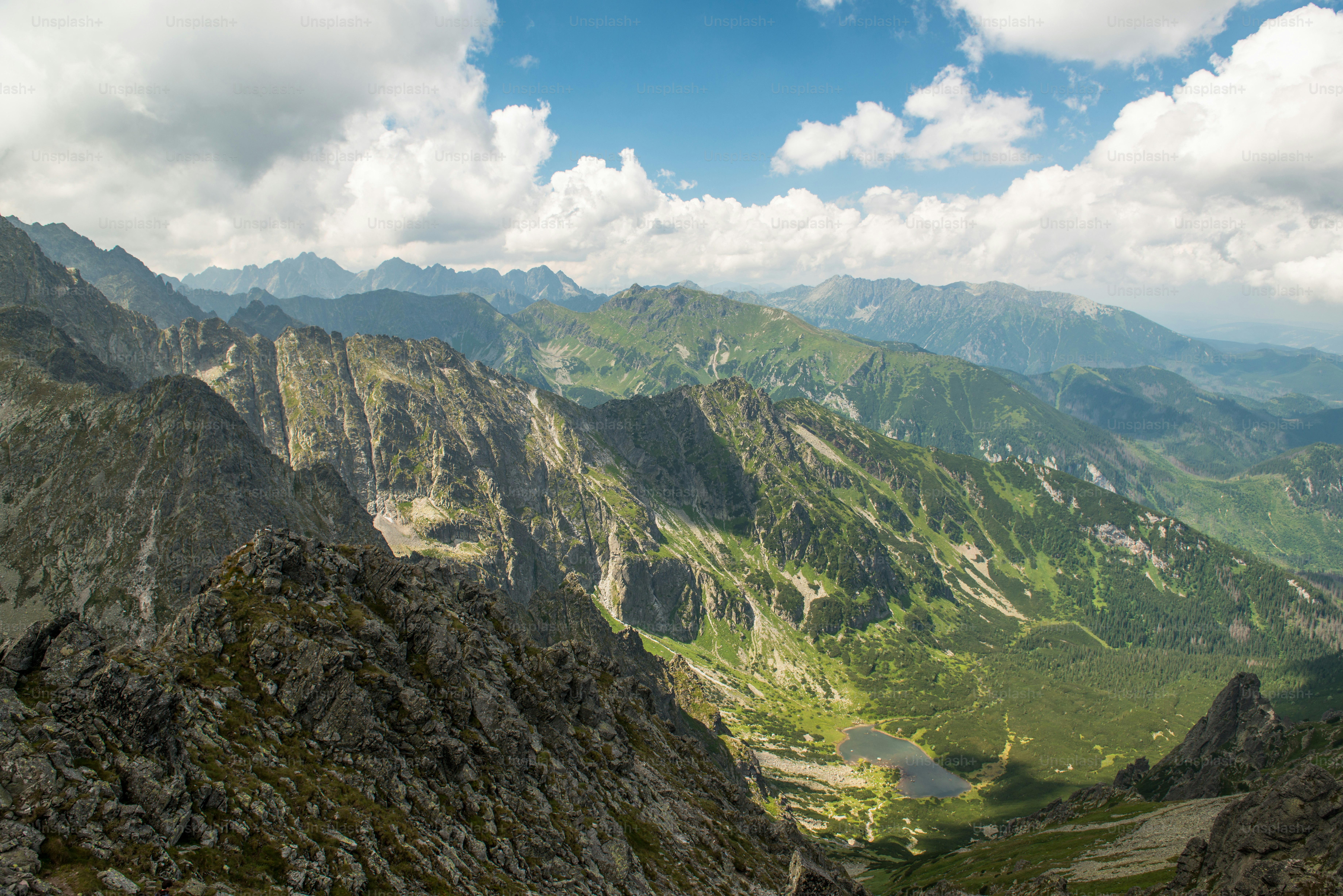 Beautiful scenery of high mountain with lake and high peak. High Tatras ...