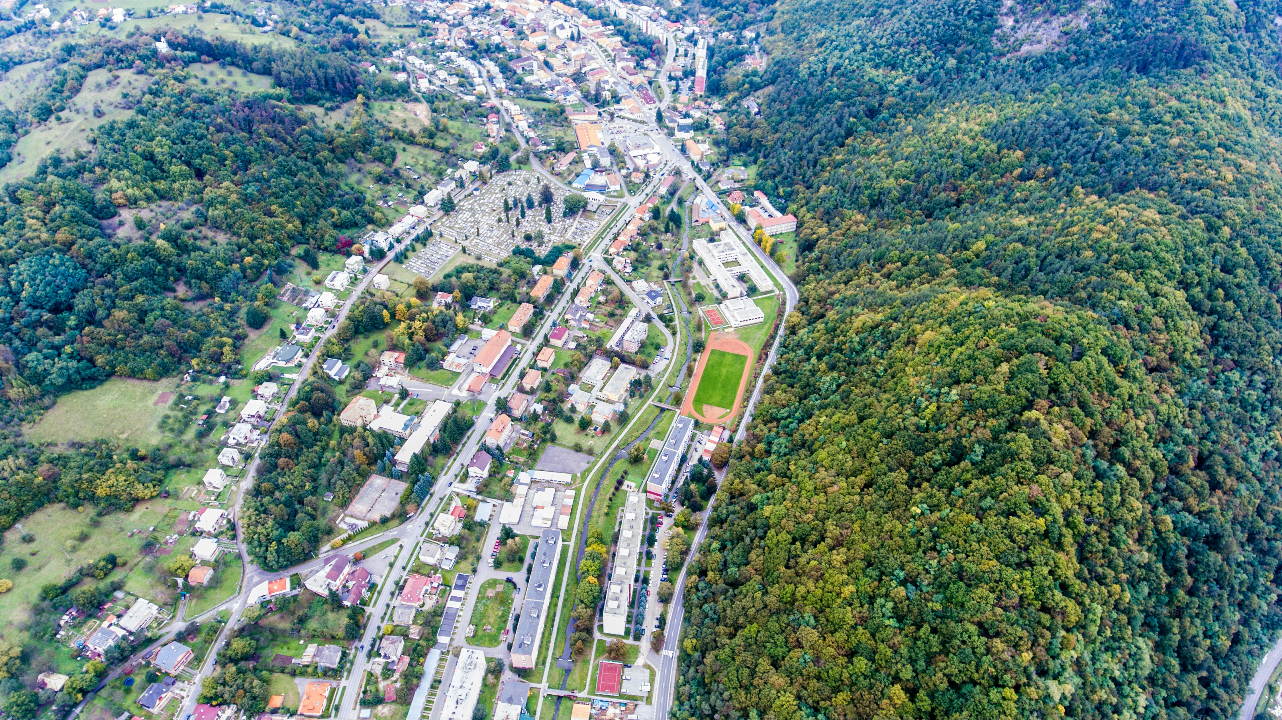 Aerial view of residential neighborhood and cementery in Banska ...