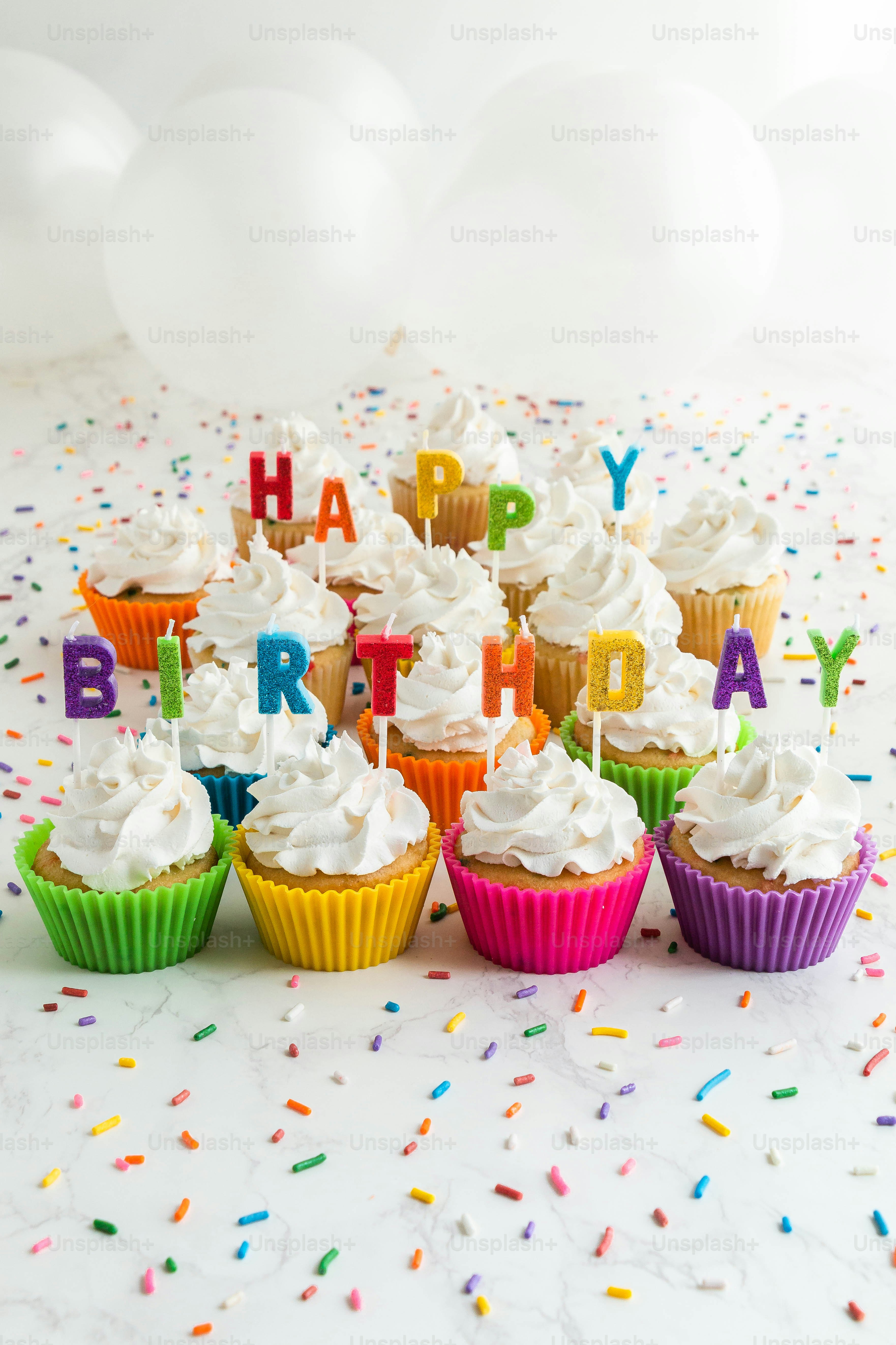 A bunch of cupcakes that are sitting on a table photo – Birthday Image ...