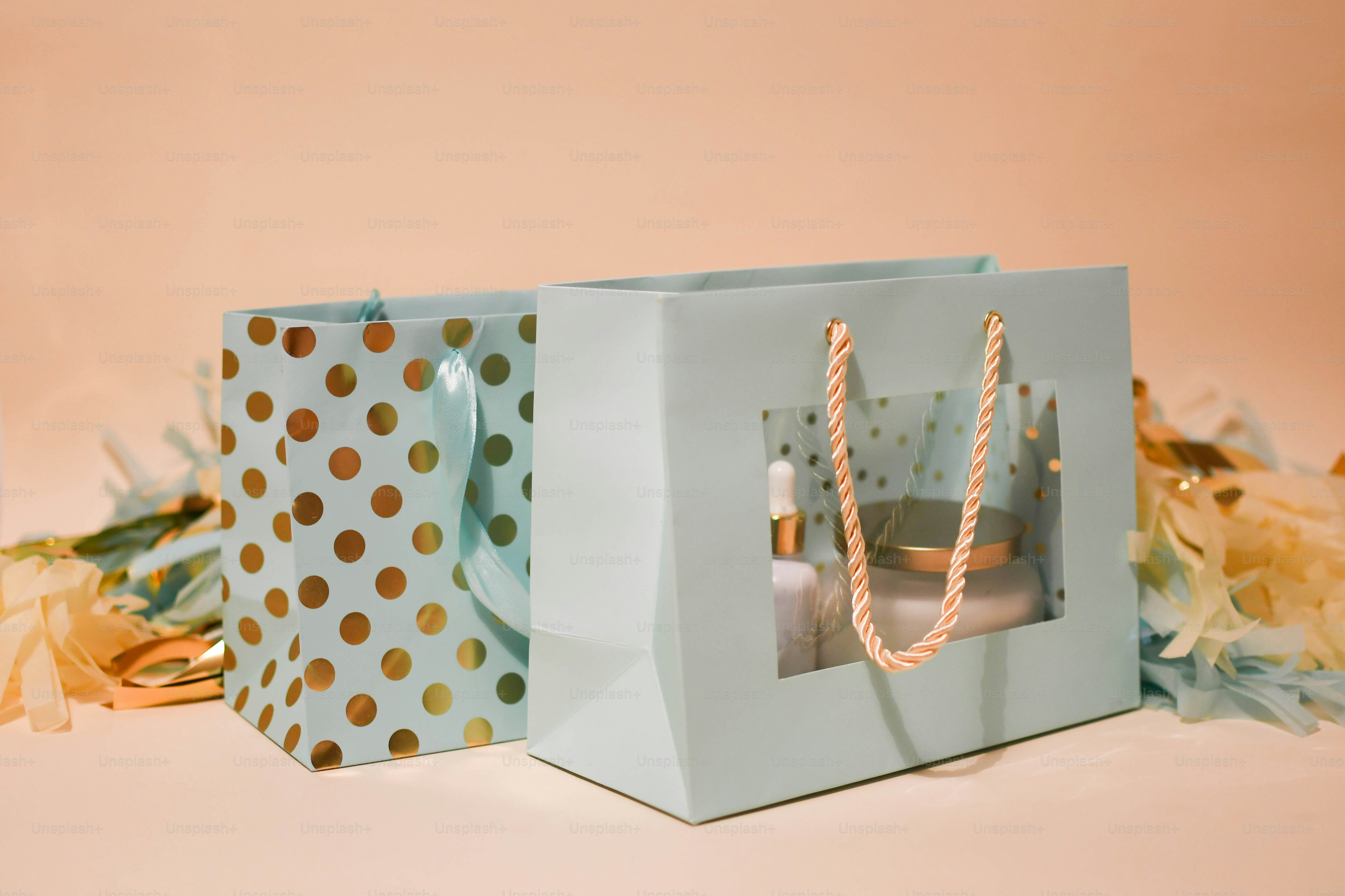 A paper bag with a candle inside of it photo – Birthday gift Image on ...