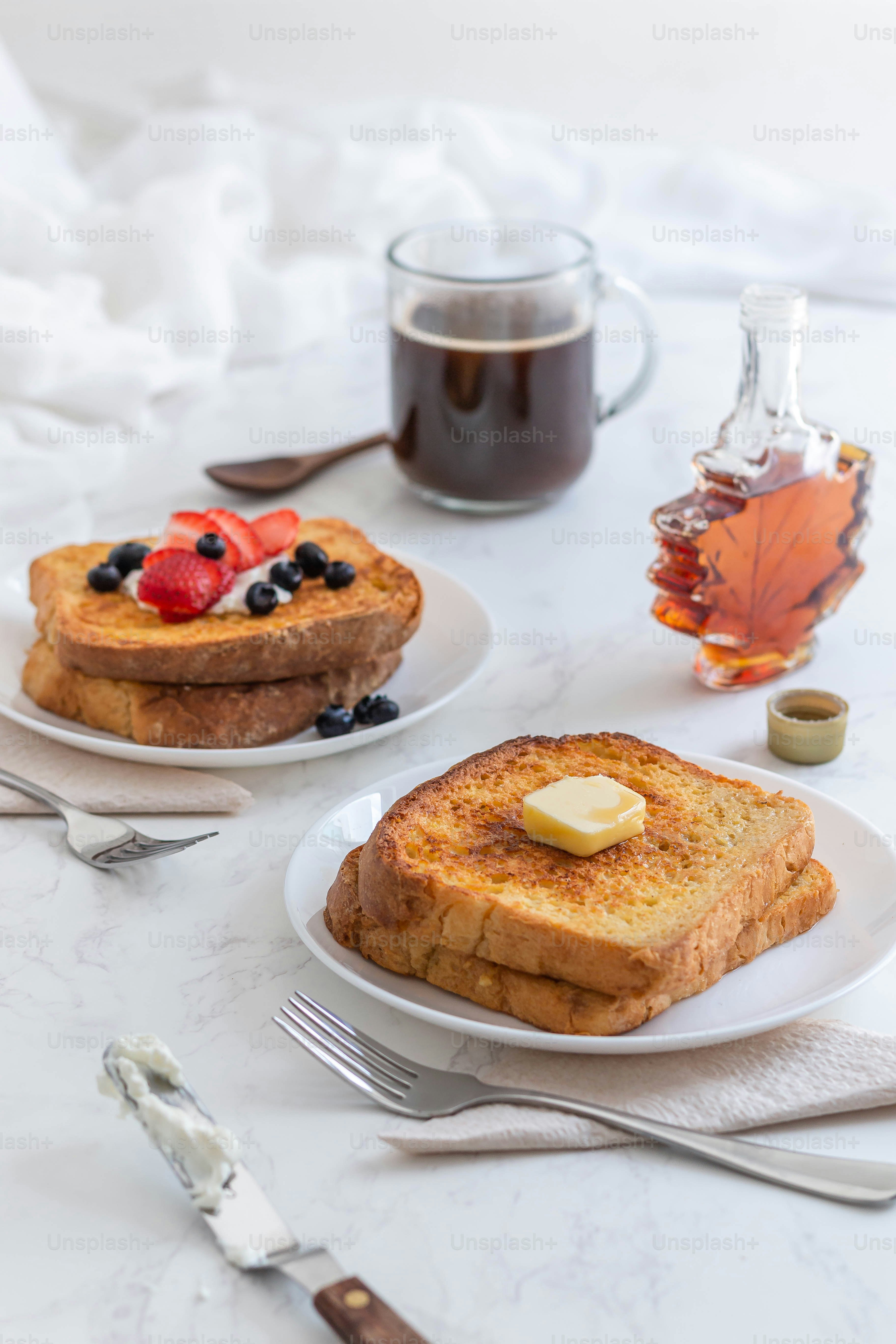 Two plates of french toast with fruit on them photo – Toast Image on ...