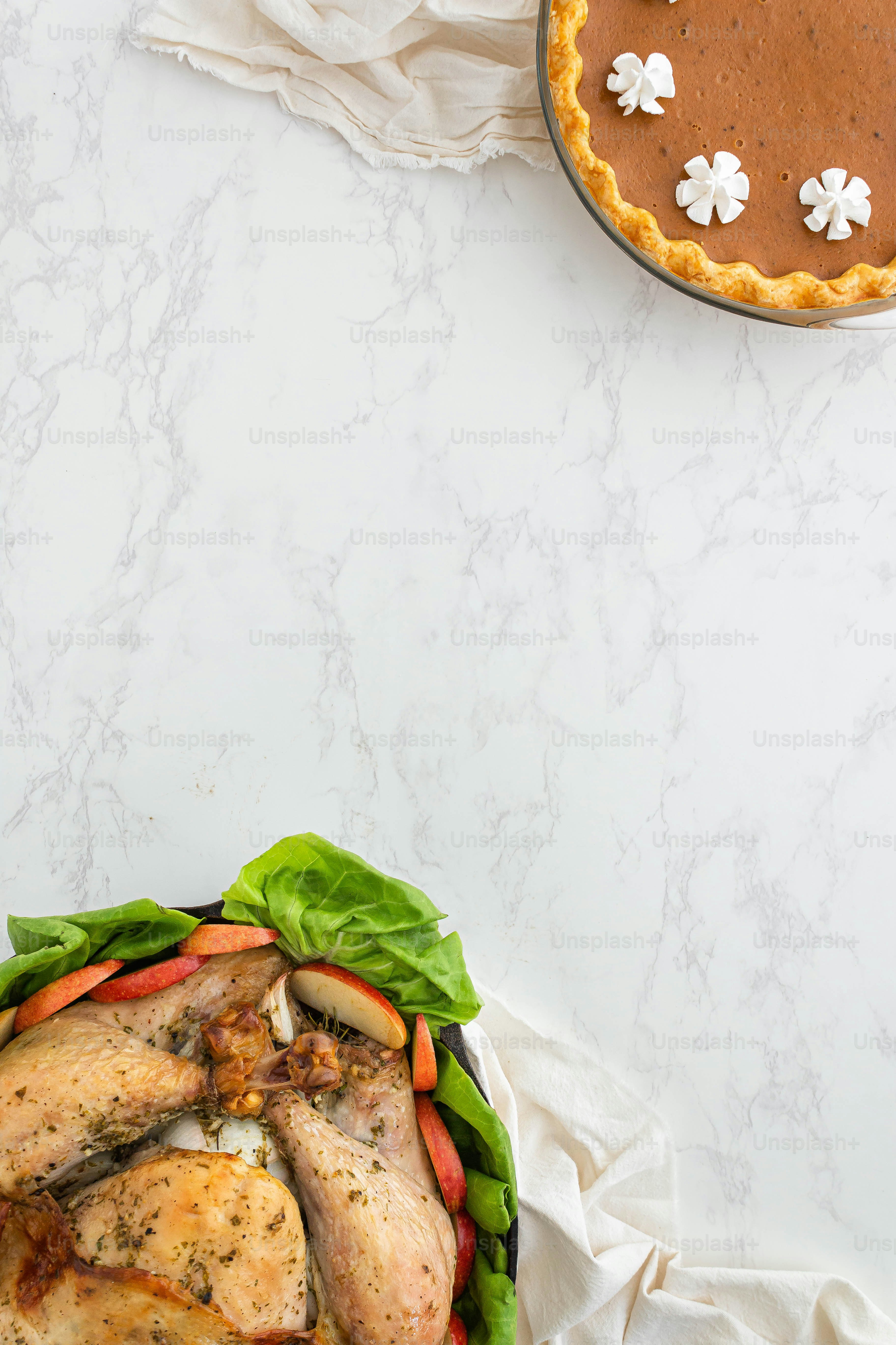 A baked chicken in a wrapper next to a pie photo – Pumpkin pie Image on ...