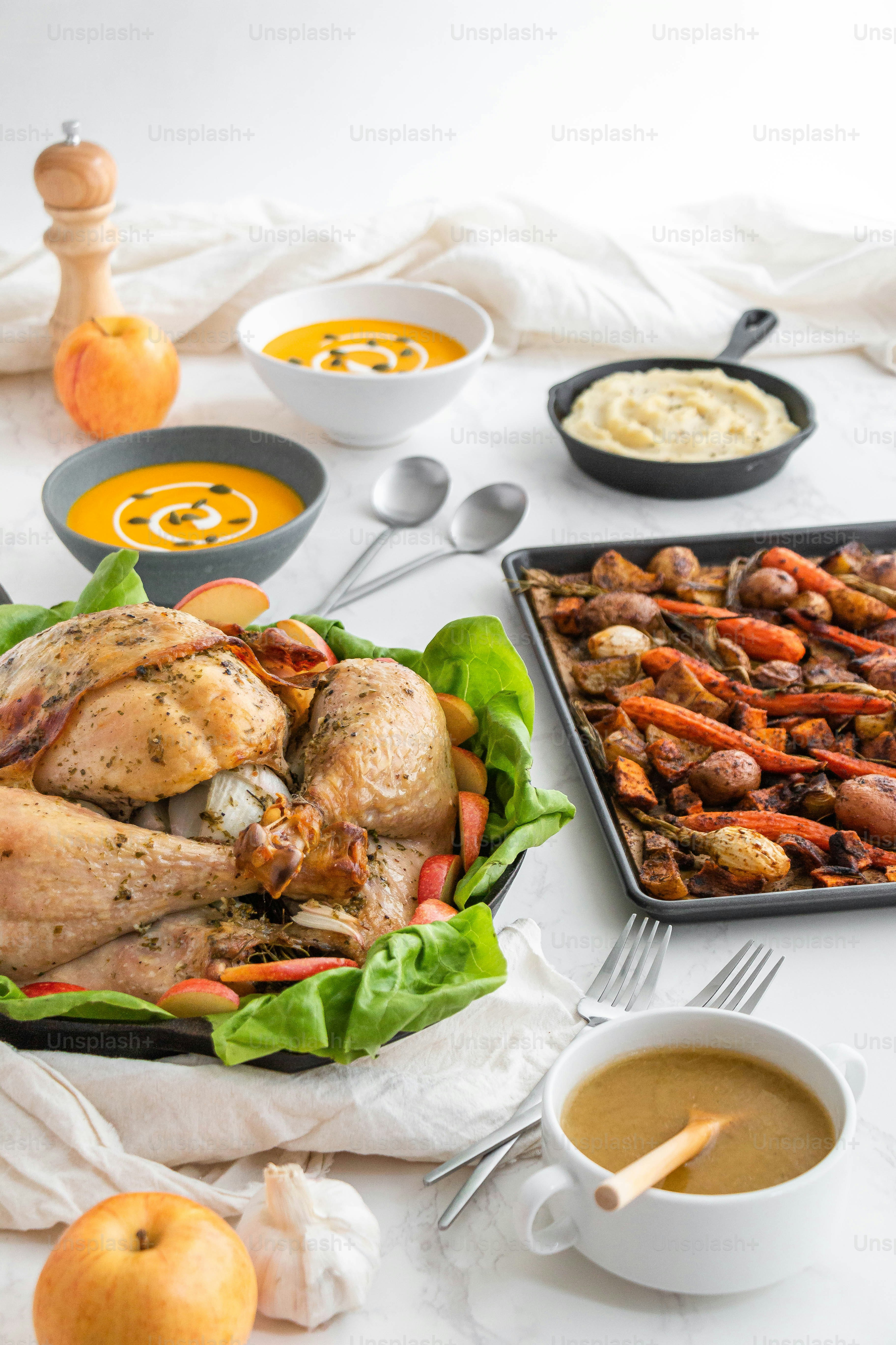 A table topped with a turkey and other foods photo – Feast Image on ...