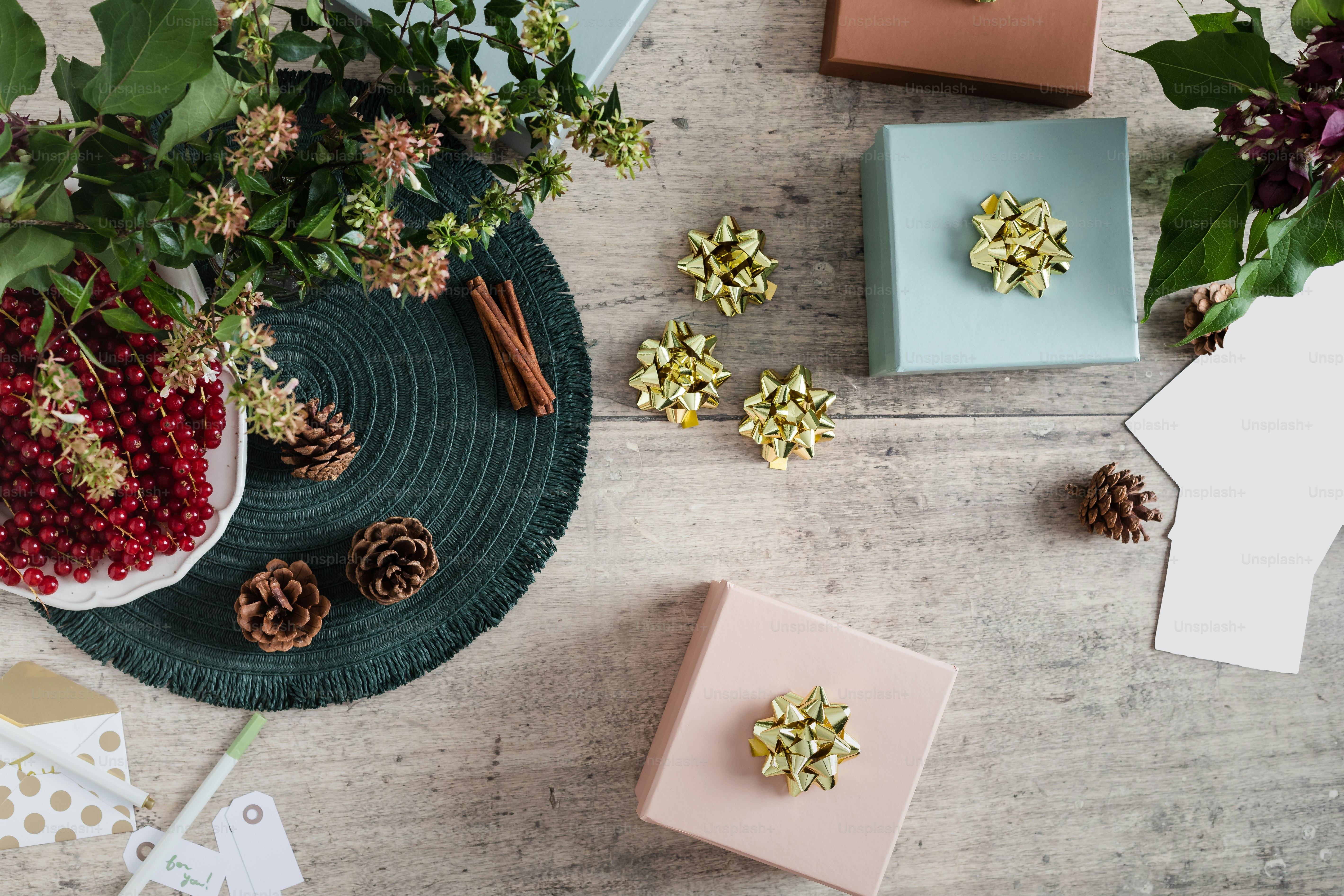 A table topped with lots of different types of gifts photo – Christmas ...