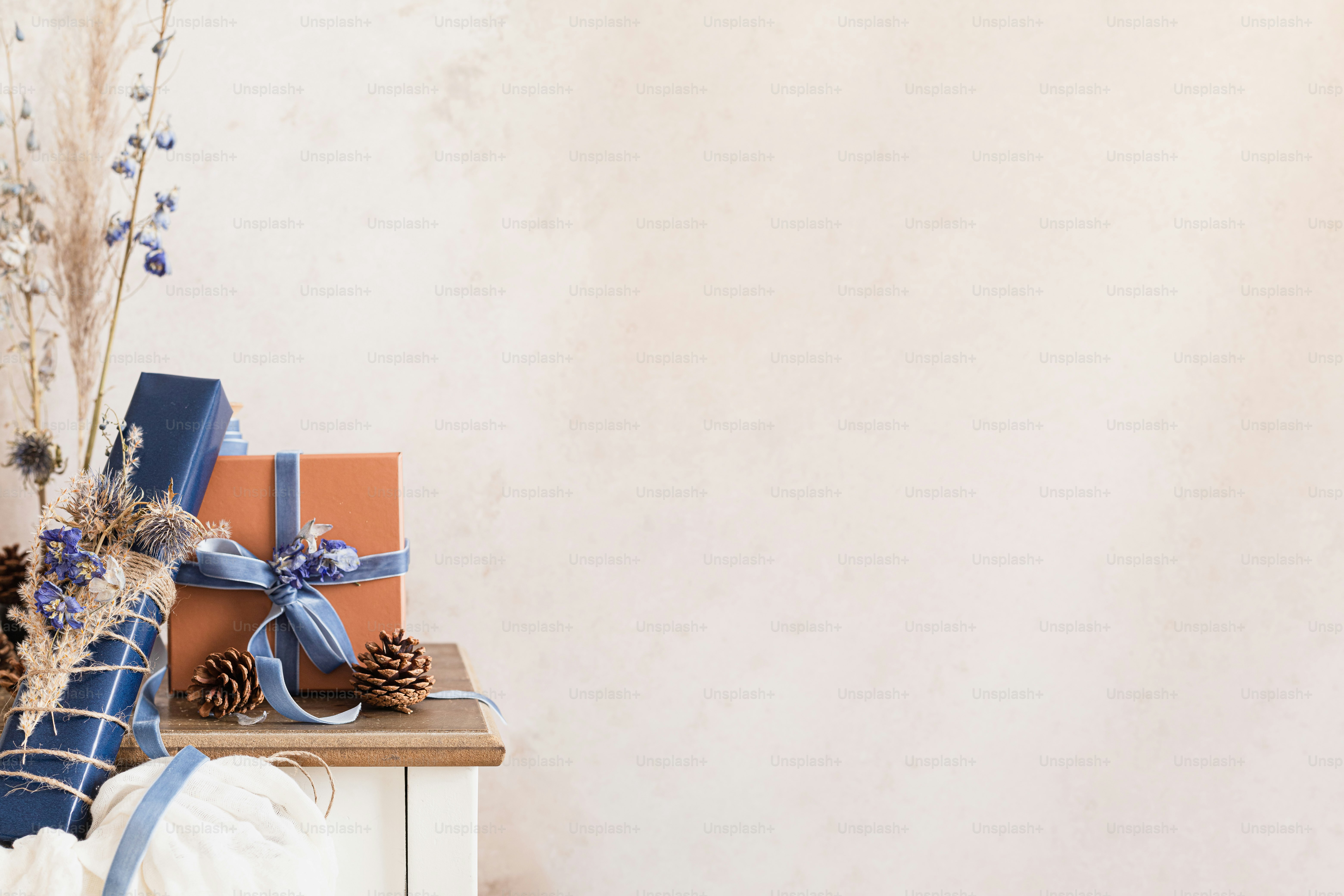 A stack of presents sitting on top of a table photo – Christmas Image ...