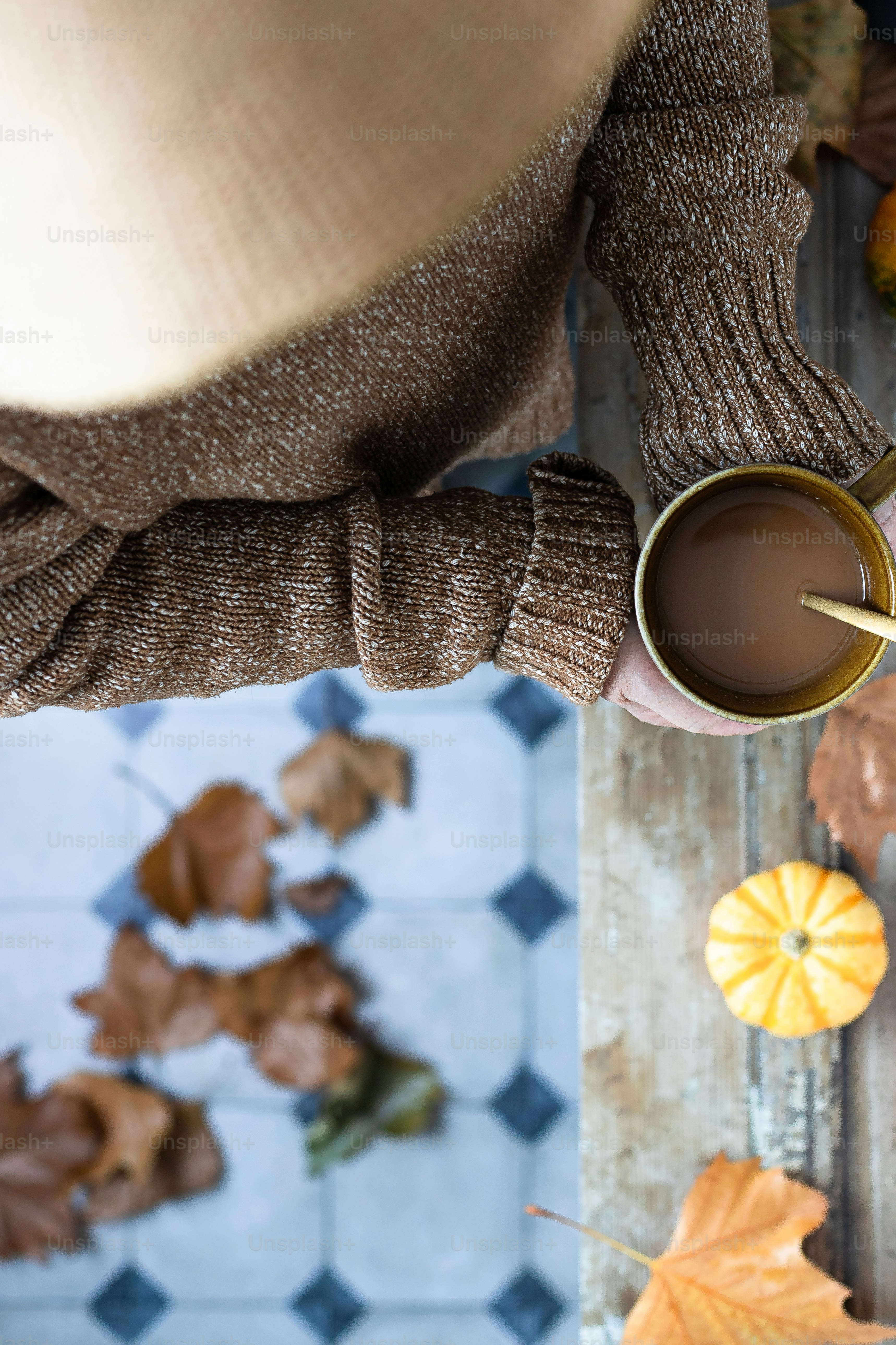A person holding a cup of coffee in their hands photo – Autumn coffee ...