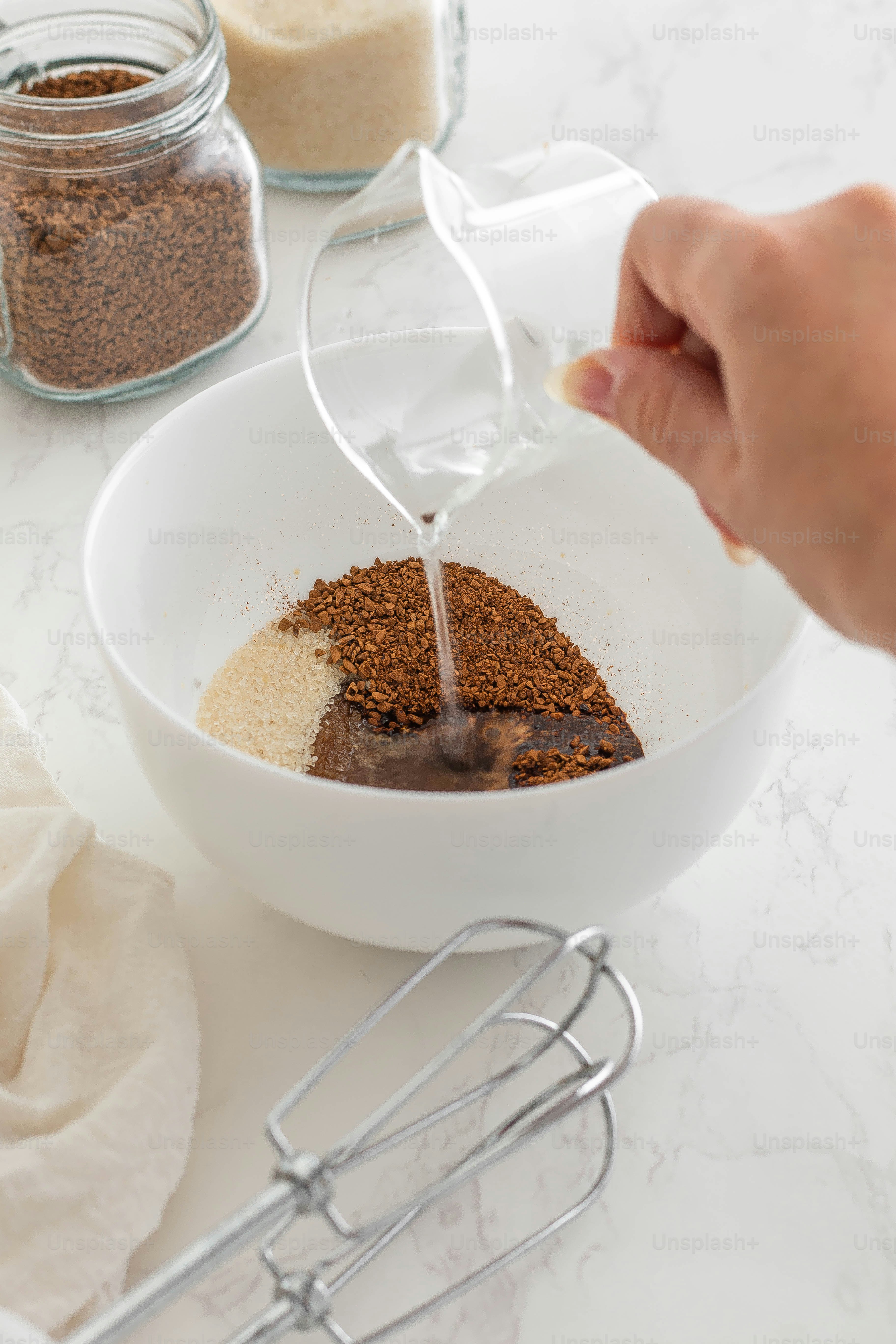 A person pouring a mixture into a bowl photo – Healthy drink Image on ...