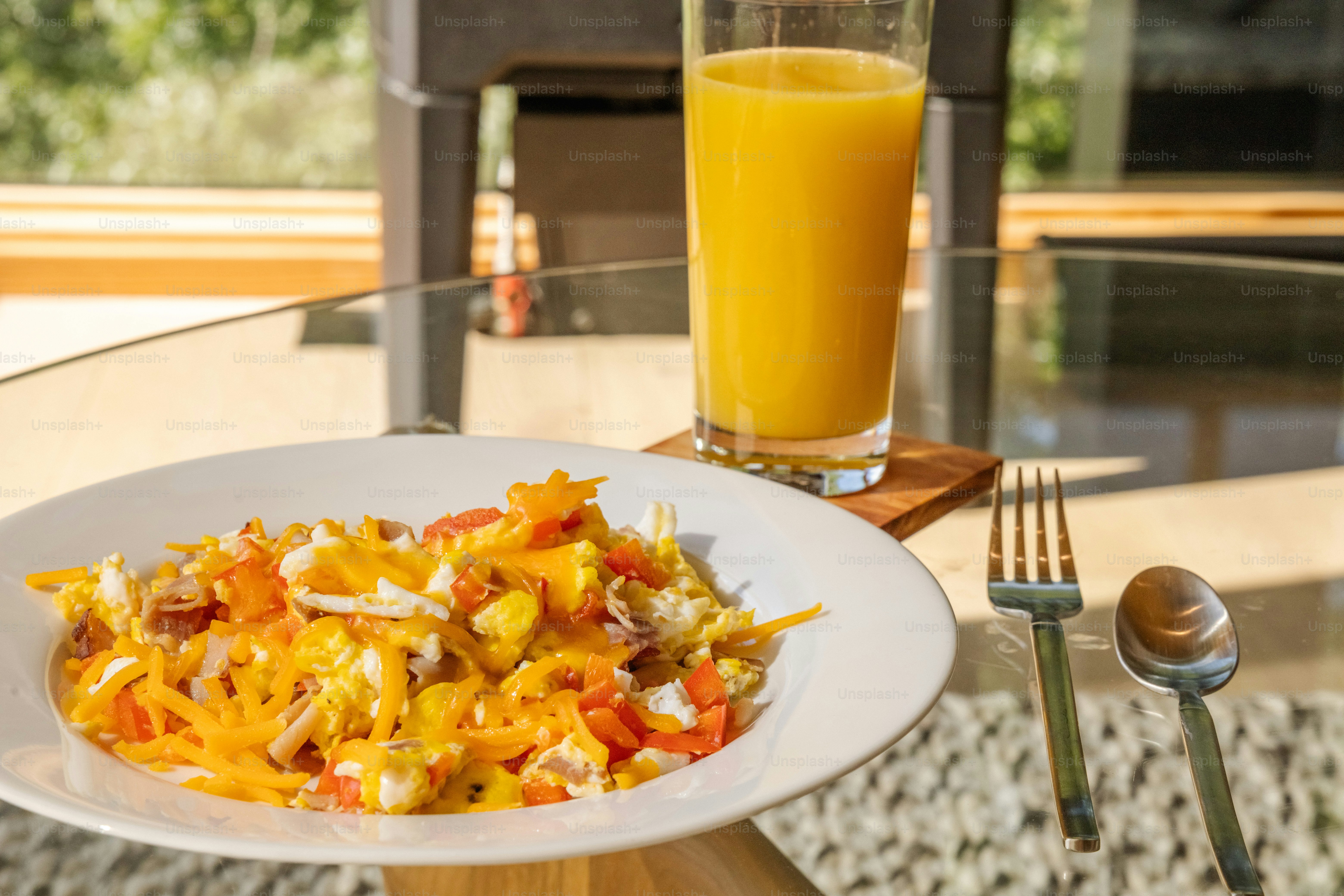 A plate of food and a glass of orange juice photo – Breakfast Image on ...