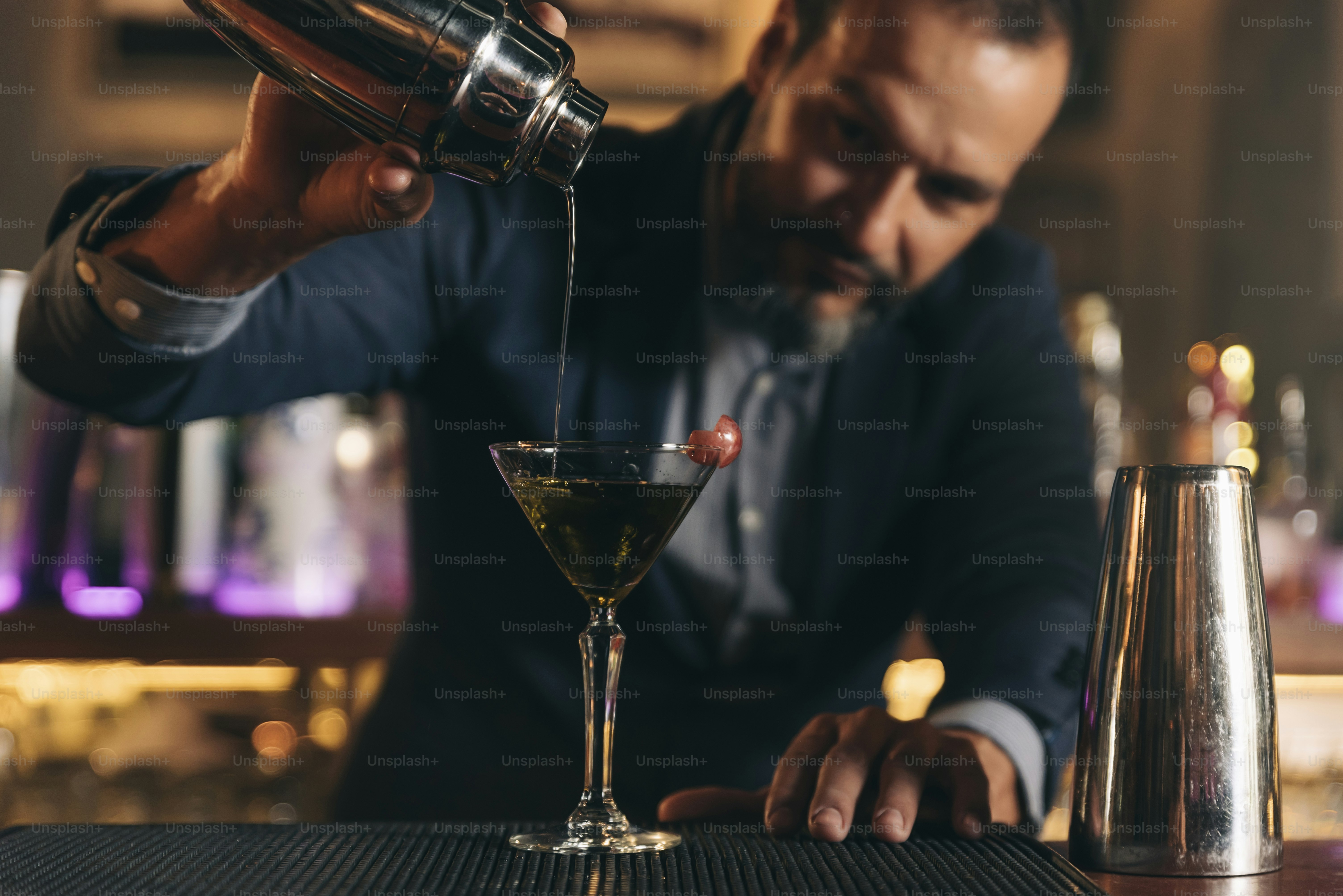 Expert barman is making cocktail at night club. photo – Happy hour ...