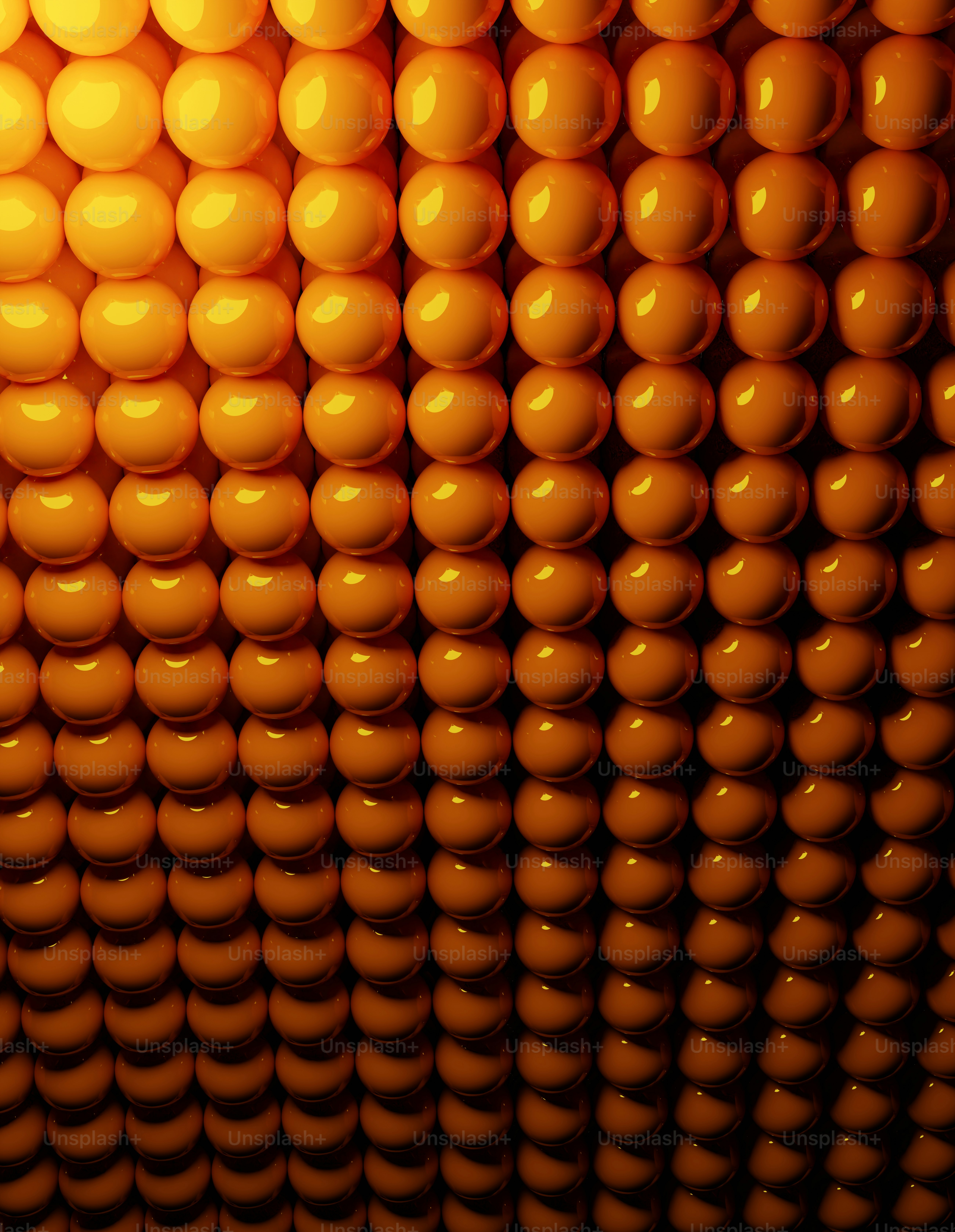 A wall made up of orange balls in a room photo – Wallpaper Image on ...