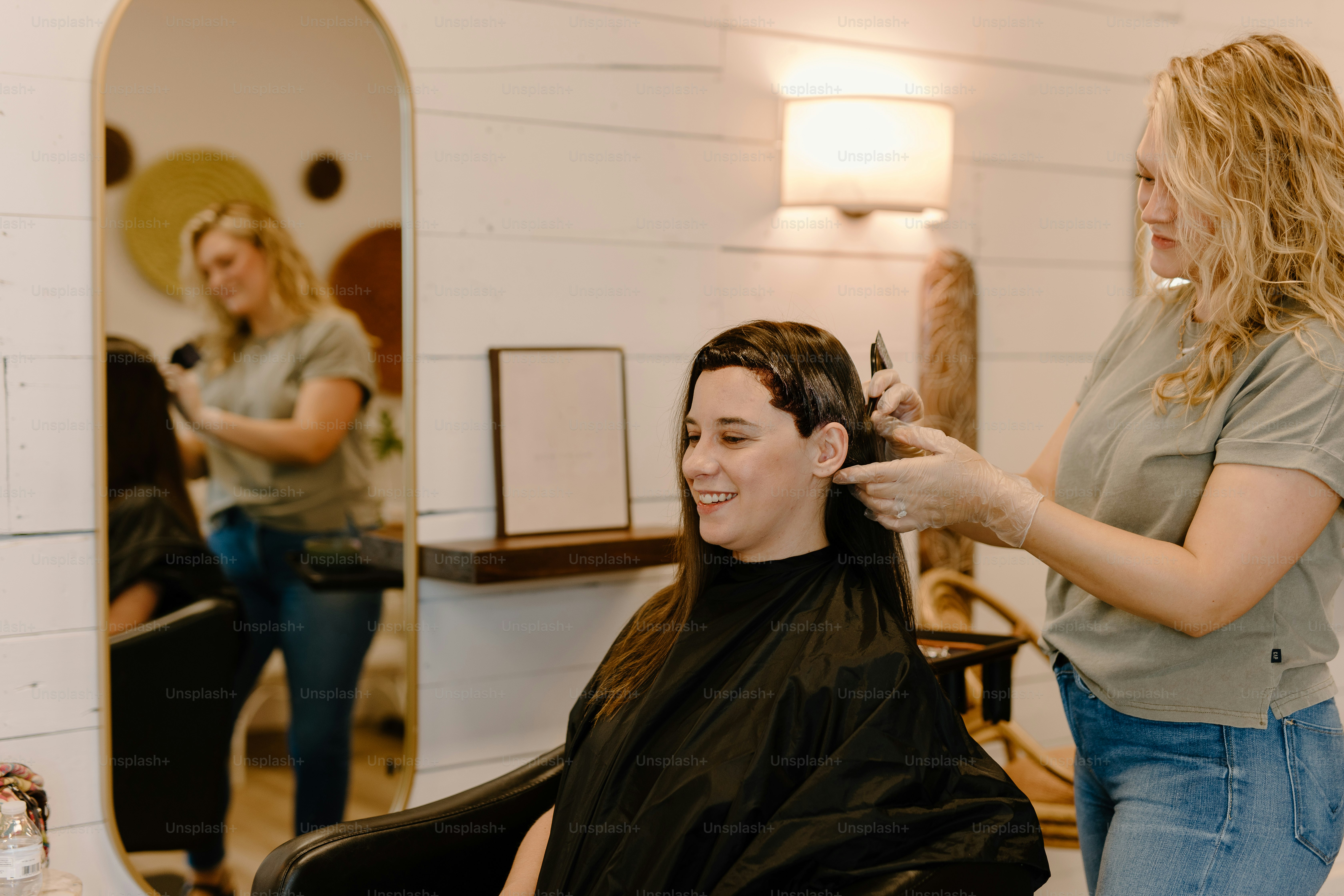 A woman getting her hair cut in a salon photo – Cutting hair Image on ...