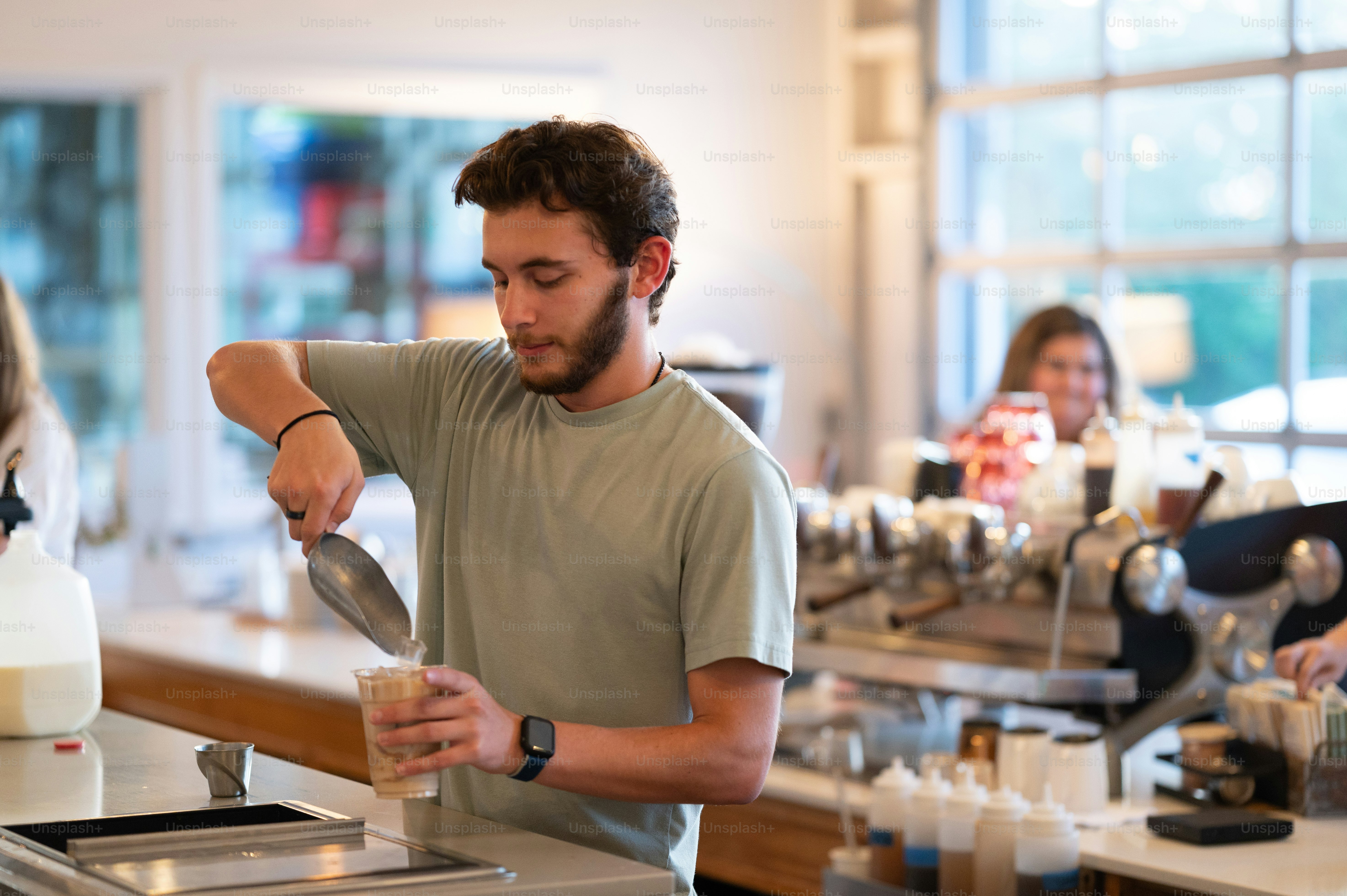 A man pouring a drink into a glass photo – Restaurant Image on Unsplash